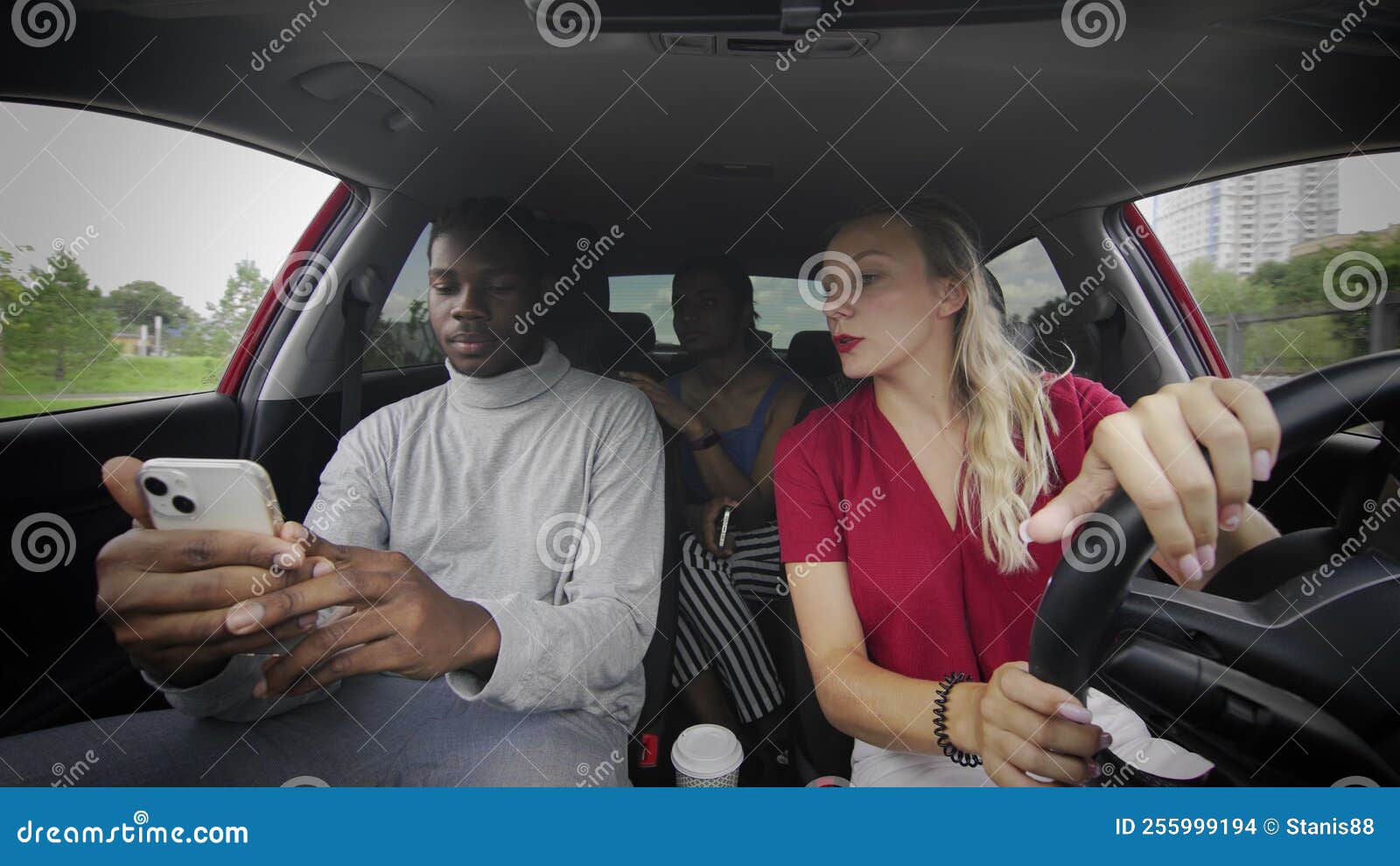 A Group of Friends of Different Nationalities are Driving by Car on the ...