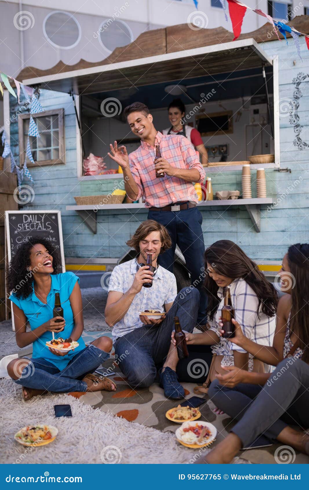 Group of Friends Drinking Beer while Having Lunch Stock Image - Image ...