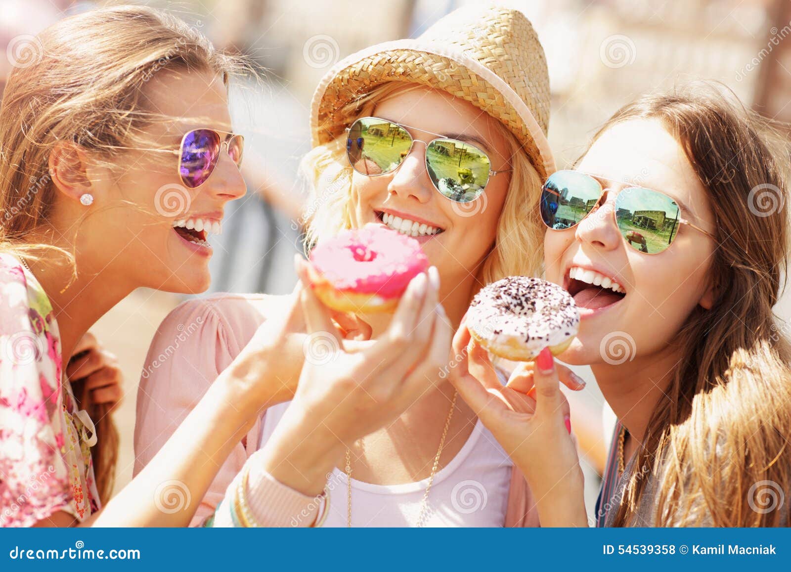 Group of Friends Eating Donuts in the City Stock Photo - Image of ...