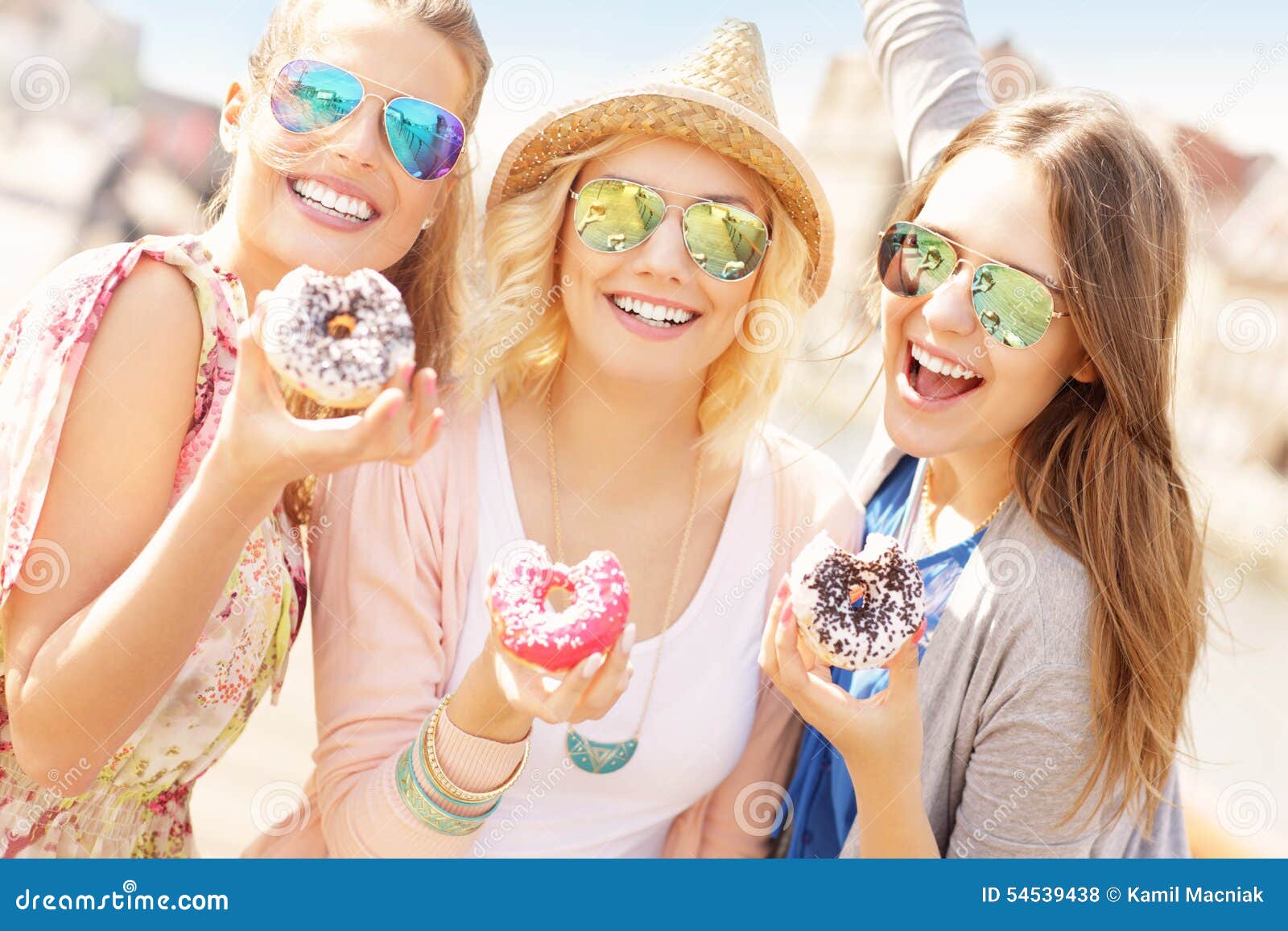 Group of Friends Eating Donuts in the City Stock Photo - Image of ...