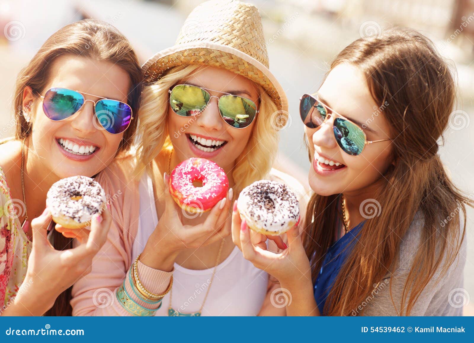 Group of Friends Eating Donuts in the City Stock Photo - Image of ...