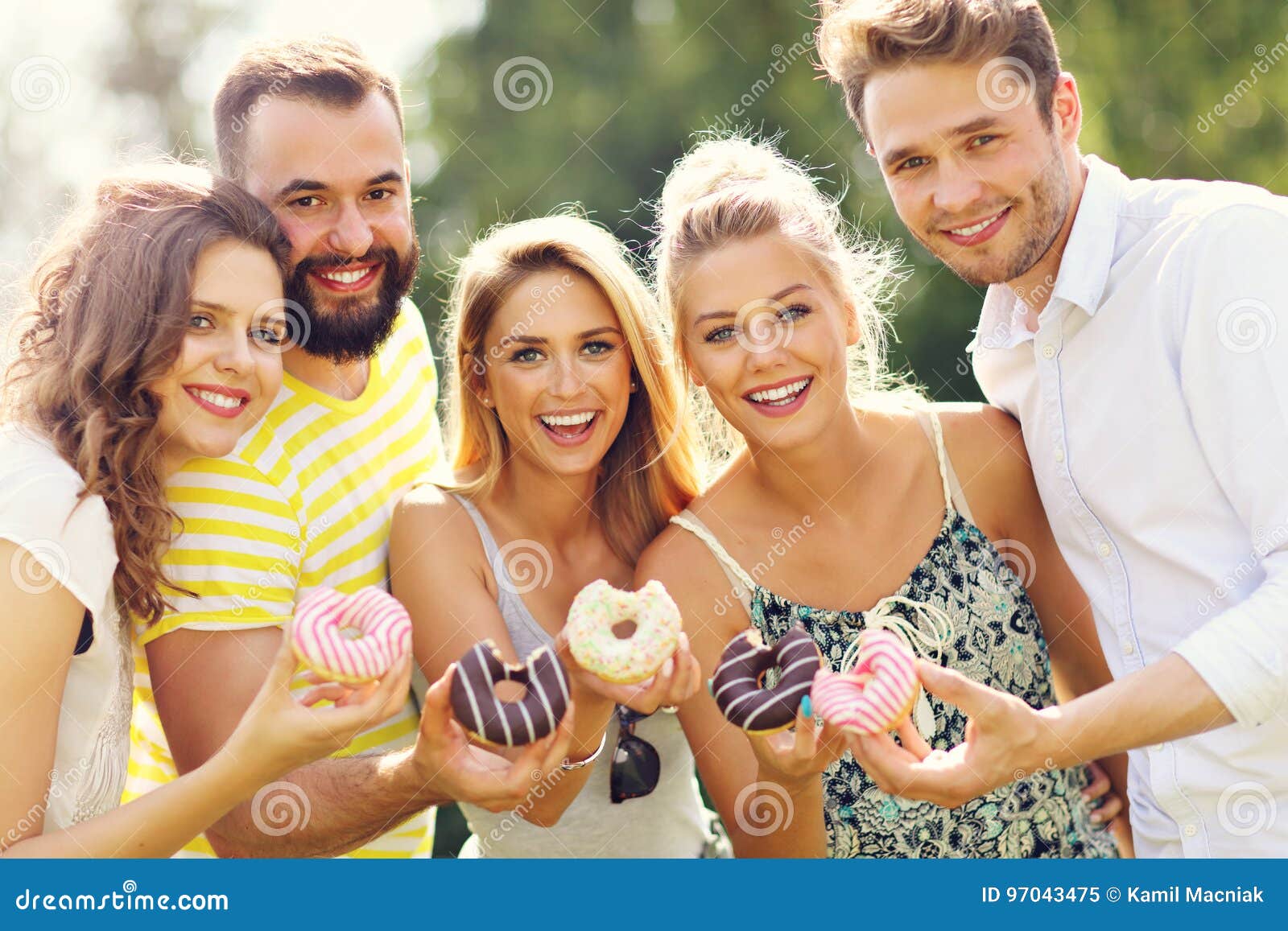 Group of Friends Eating Donuts Outdoors Stock Image - Image of birthday ...