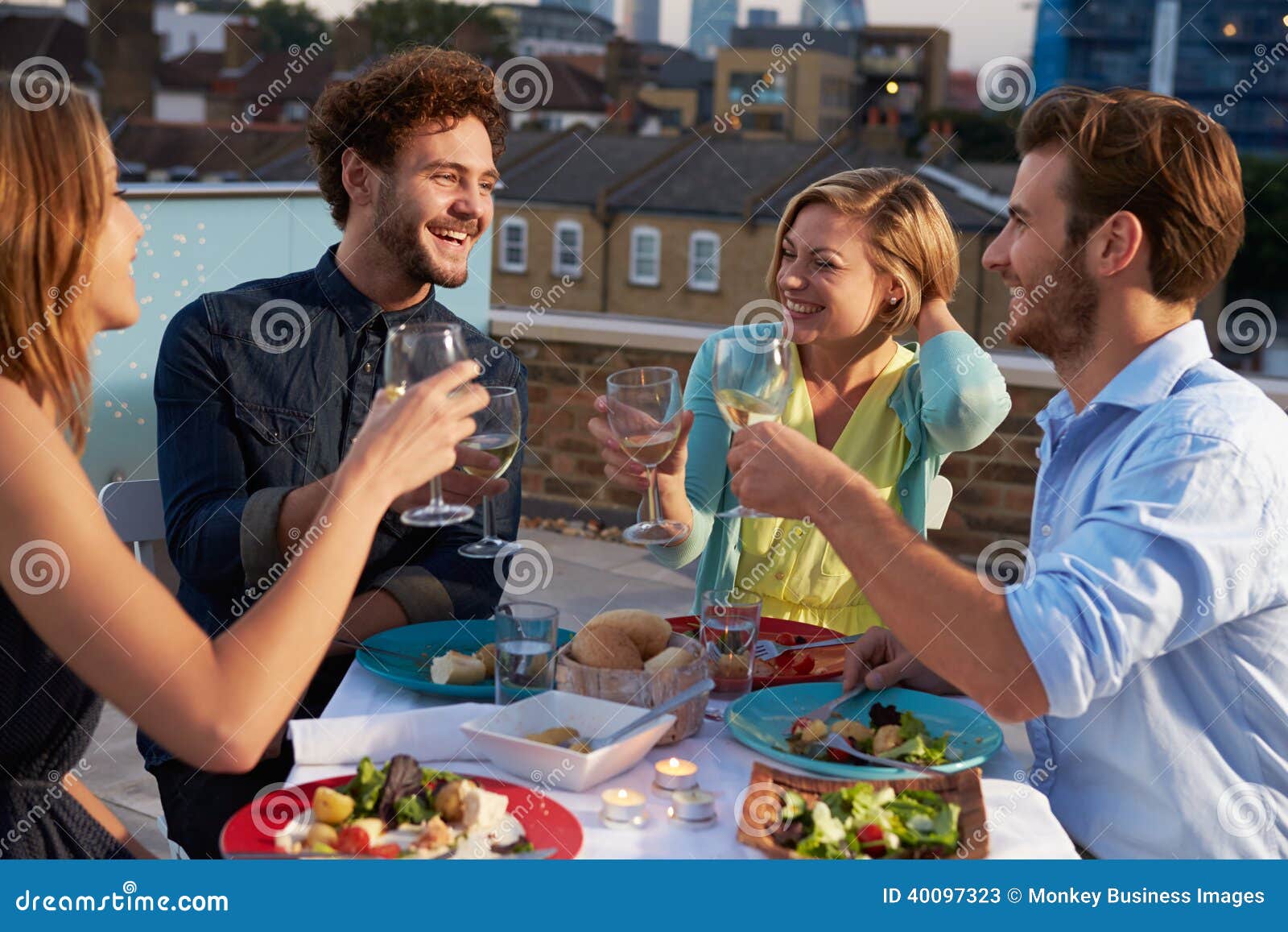 Four Friends Eating Dinner Rooftop Restaurant Stock Photos - Free ...