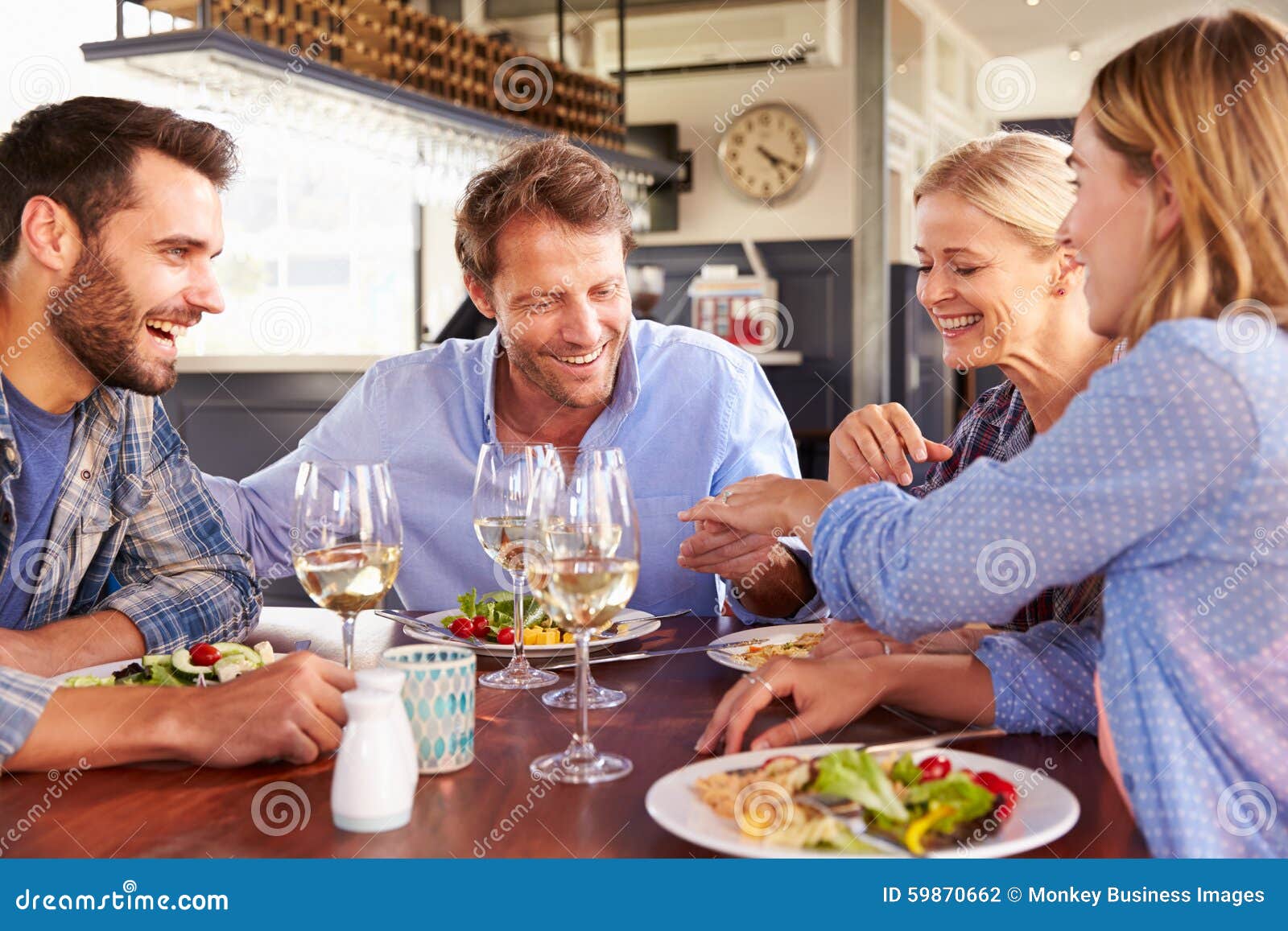 A Group of Friends Eating at a Restaurant Stock Photo - Image of happy ...