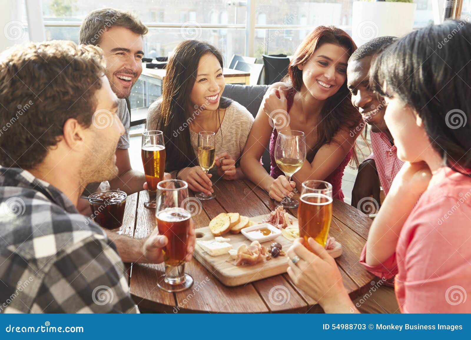Group of Friends Enjoying Drink and Snack in Rooftop Bar Stock Image ...