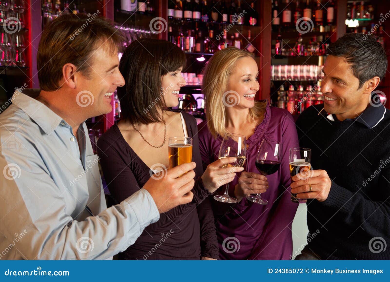 Group of Friends Enjoying Drink Together in Bar Stock Photo - Image of ...