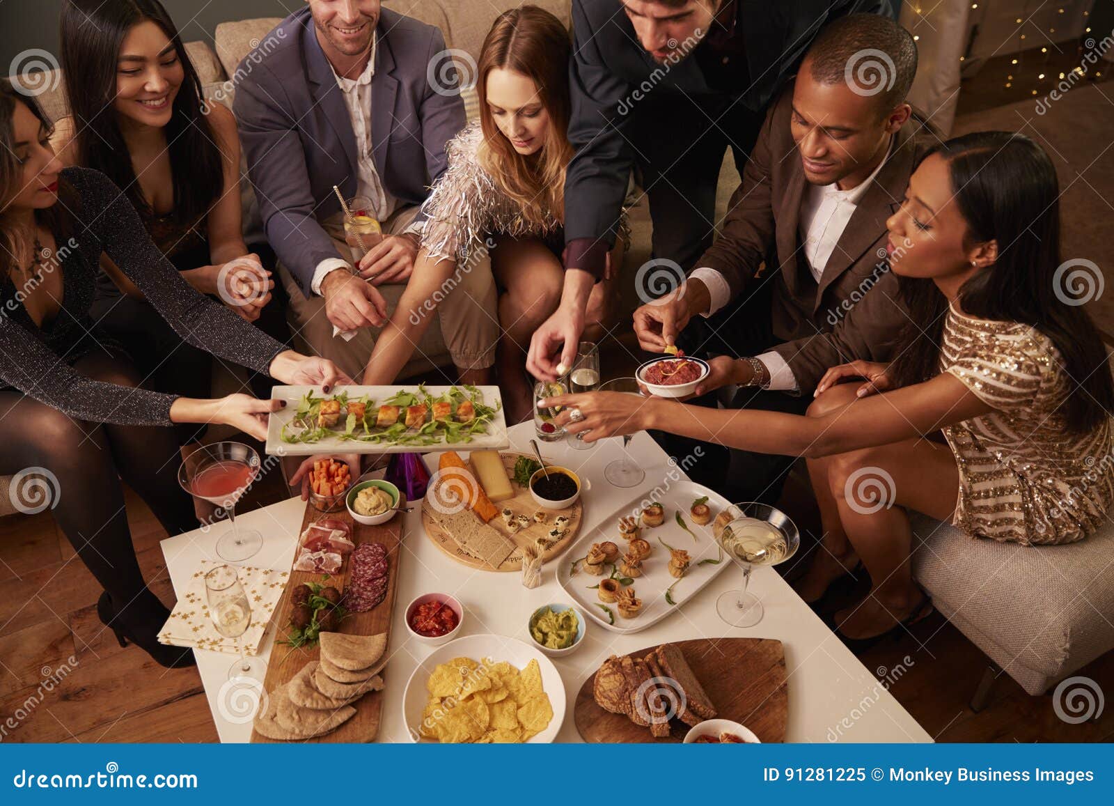 Group of Friends Enjoying Drinks and Snacks at Party Stock Image ...