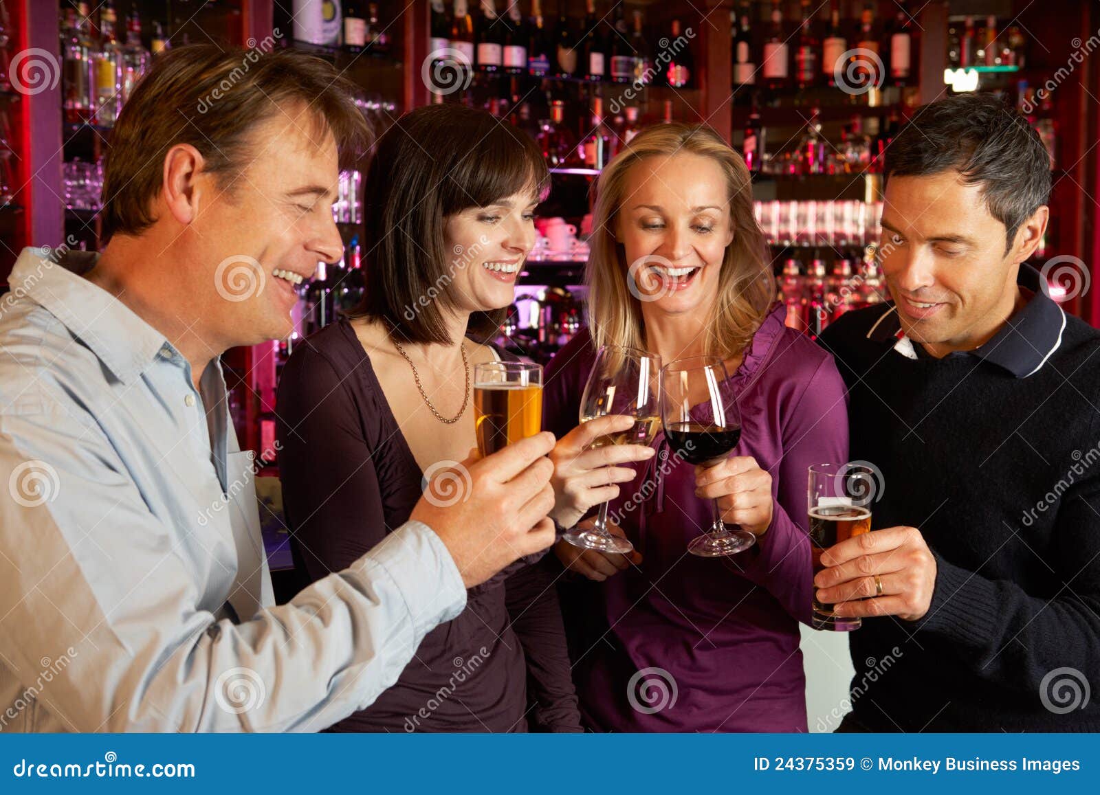 Group of Friends Enjoying Drinks Together in Bar Stock Image - Image of ...