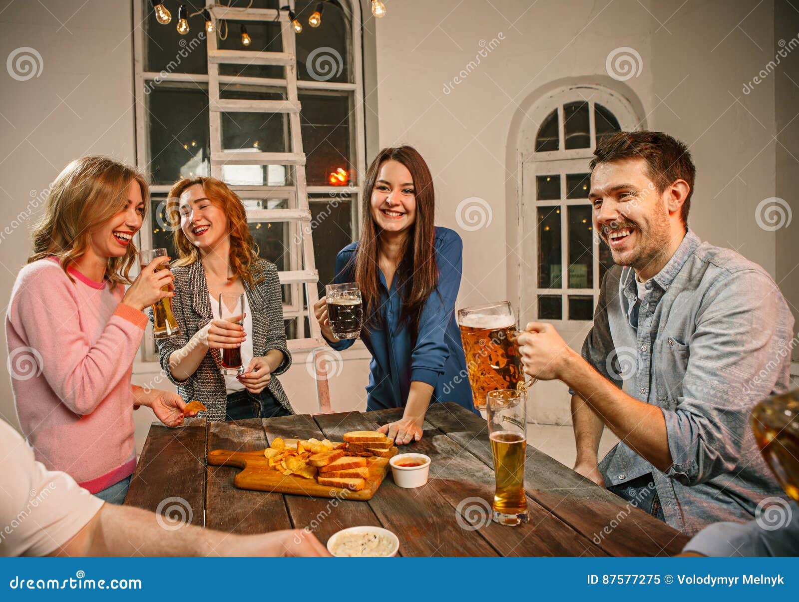 Group of Friends Enjoying Evening Drinks with Beer Stock Image - Image ...