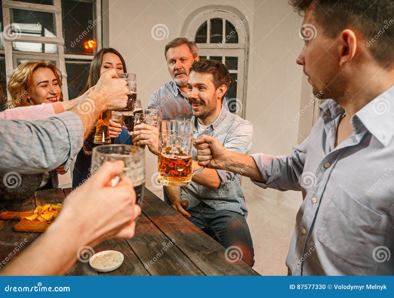 Group of Friends Enjoying Evening Drinks with Beer Stock Photo - Image ...