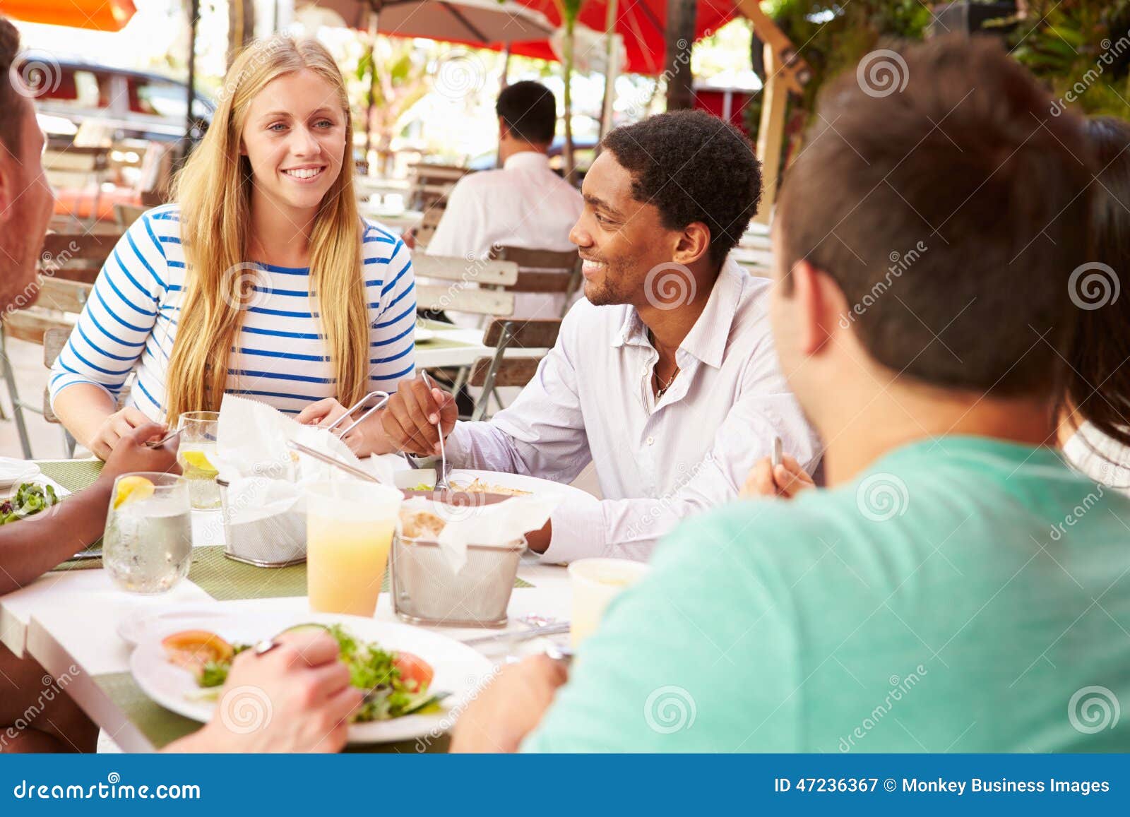 Group of Friends Enjoying Lunch in Outdoor Restaurant Stock Image ...
