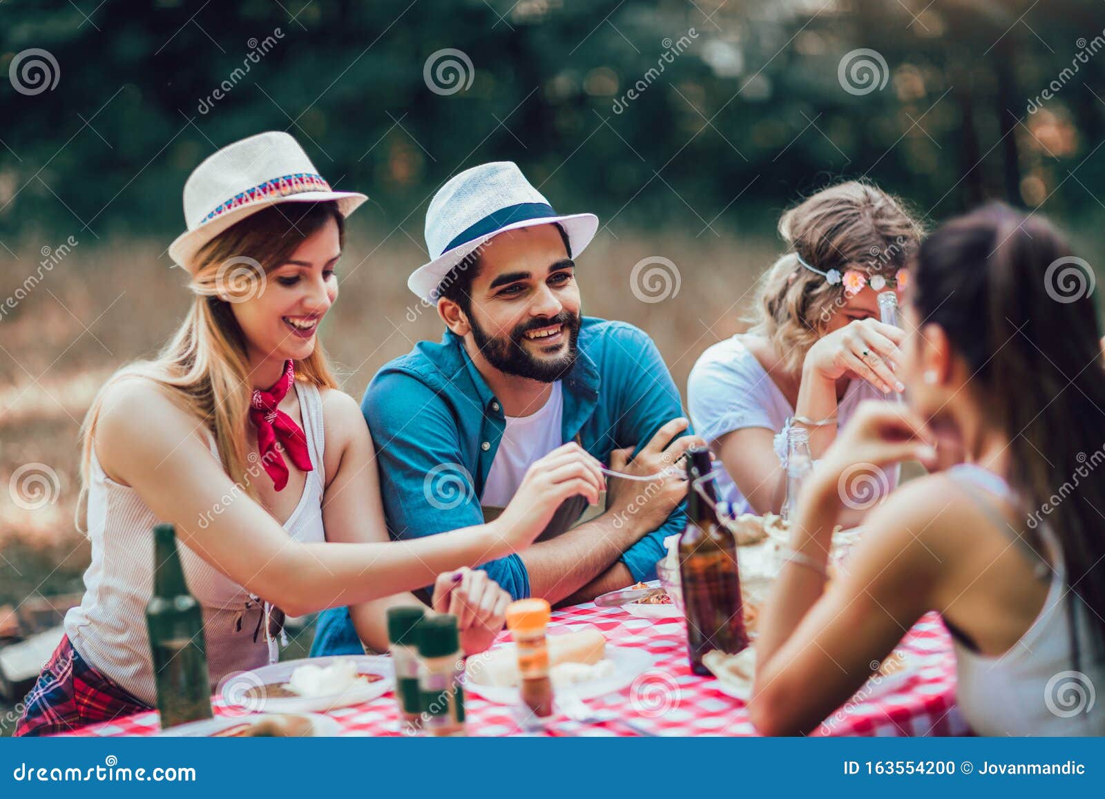 Friends Enjoying a Lunch Time Together in the Nature Stock Photo ...