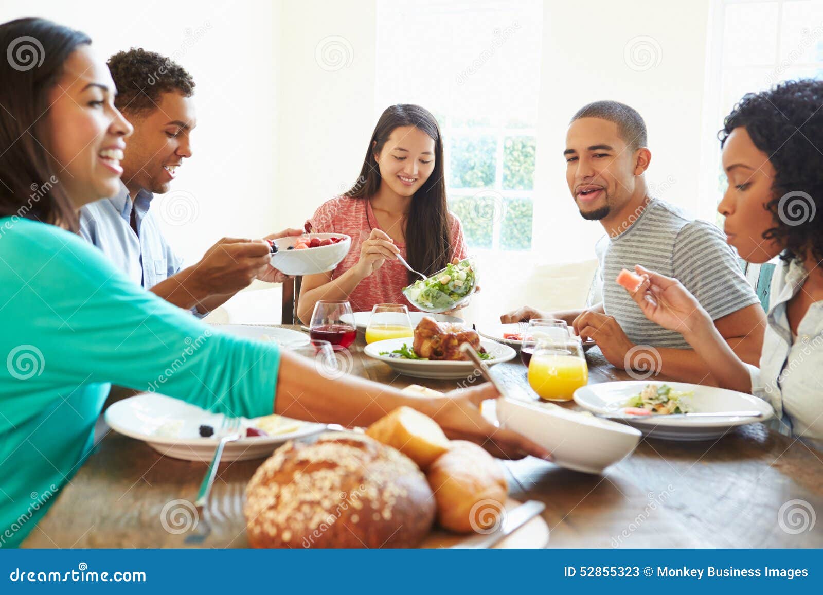 Group of Friends Enjoying Meal at Home Together Stock Image - Image of ...