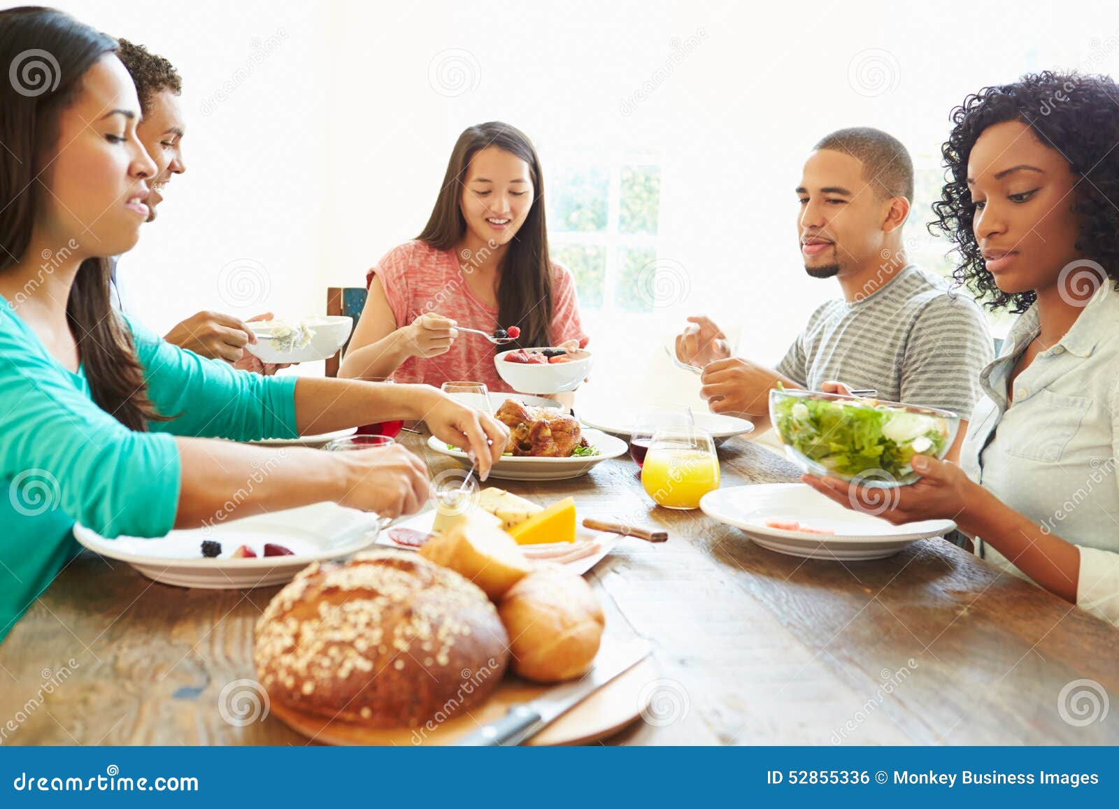 Group of Friends Enjoying Meal at Home Together Stock Photo - Image of ...