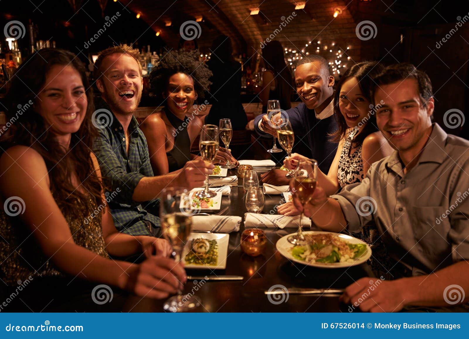 Group of Friends Enjoying Meal in Restaurant Stock Photo - Image of ...
