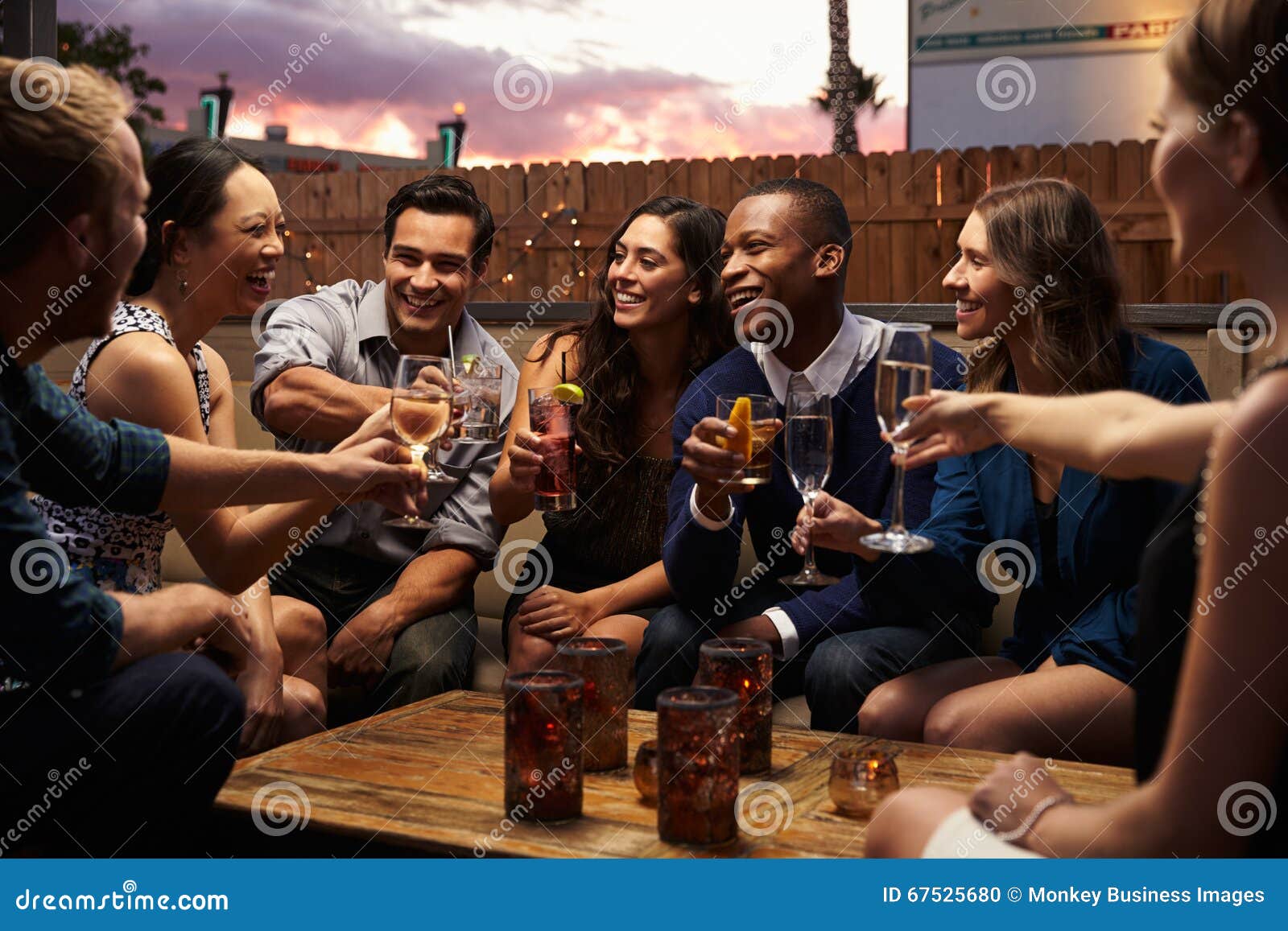 Group of Friends Enjoying Night Out at Rooftop Bar Stock Photo - Image ...