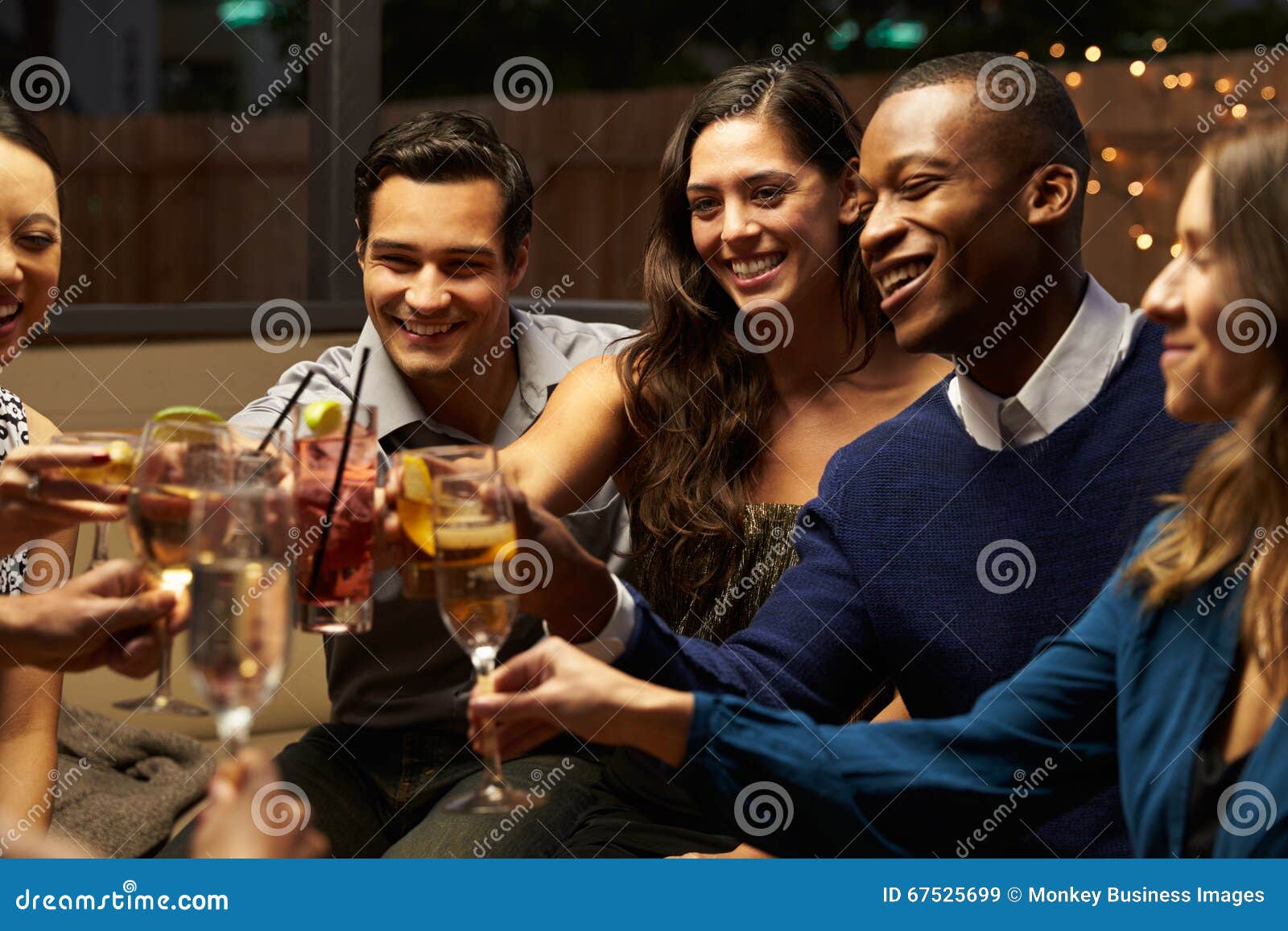 Group of Friends Enjoying Night Out at Rooftop Bar Stock Image - Image ...