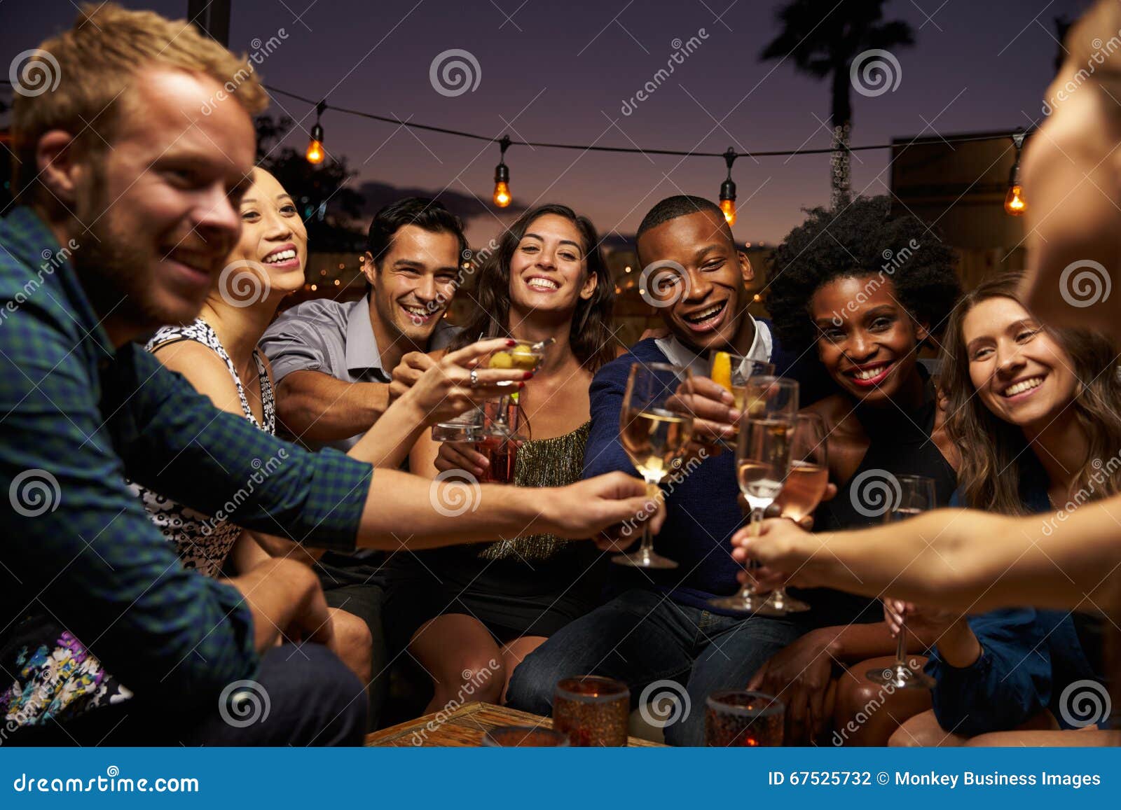 Group of Friends Enjoying Night Out at Rooftop Bar Stock Photo - Image ...