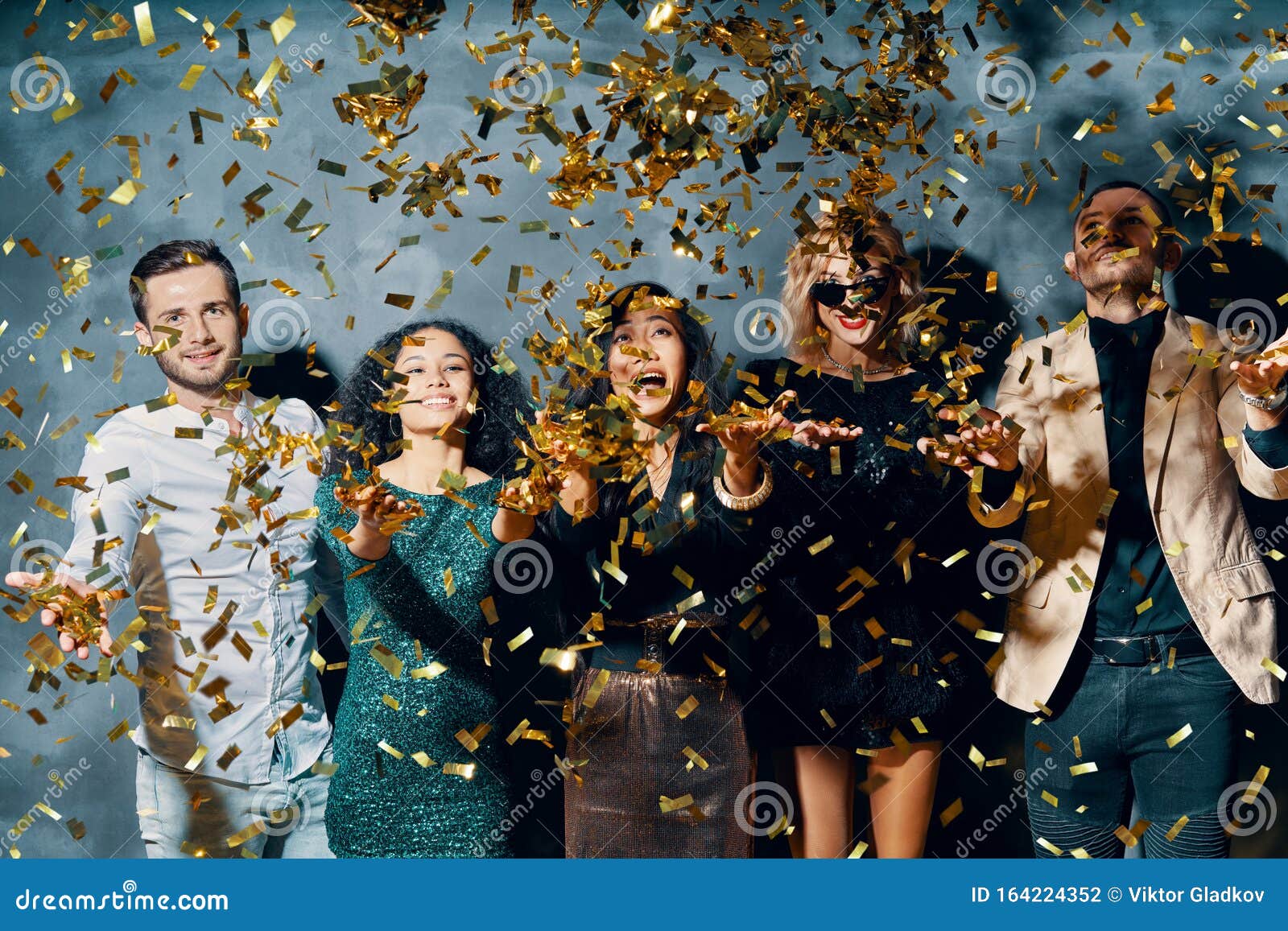 Group of Friends Enjoying Party, Dancing and Throwing Confetti Stock ...