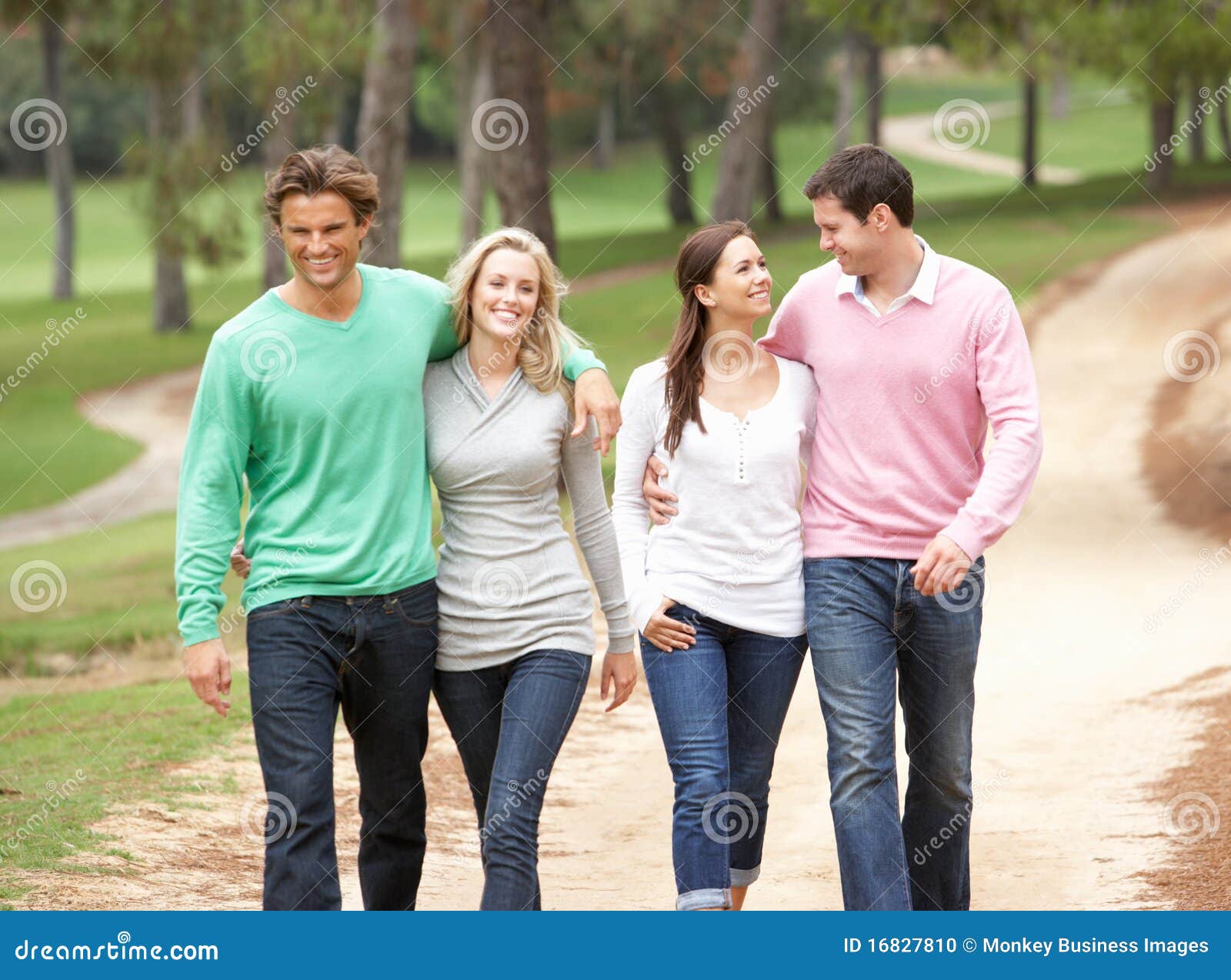 Group of Friends Enjoying Walk in Park Stock Photo - Image of ...