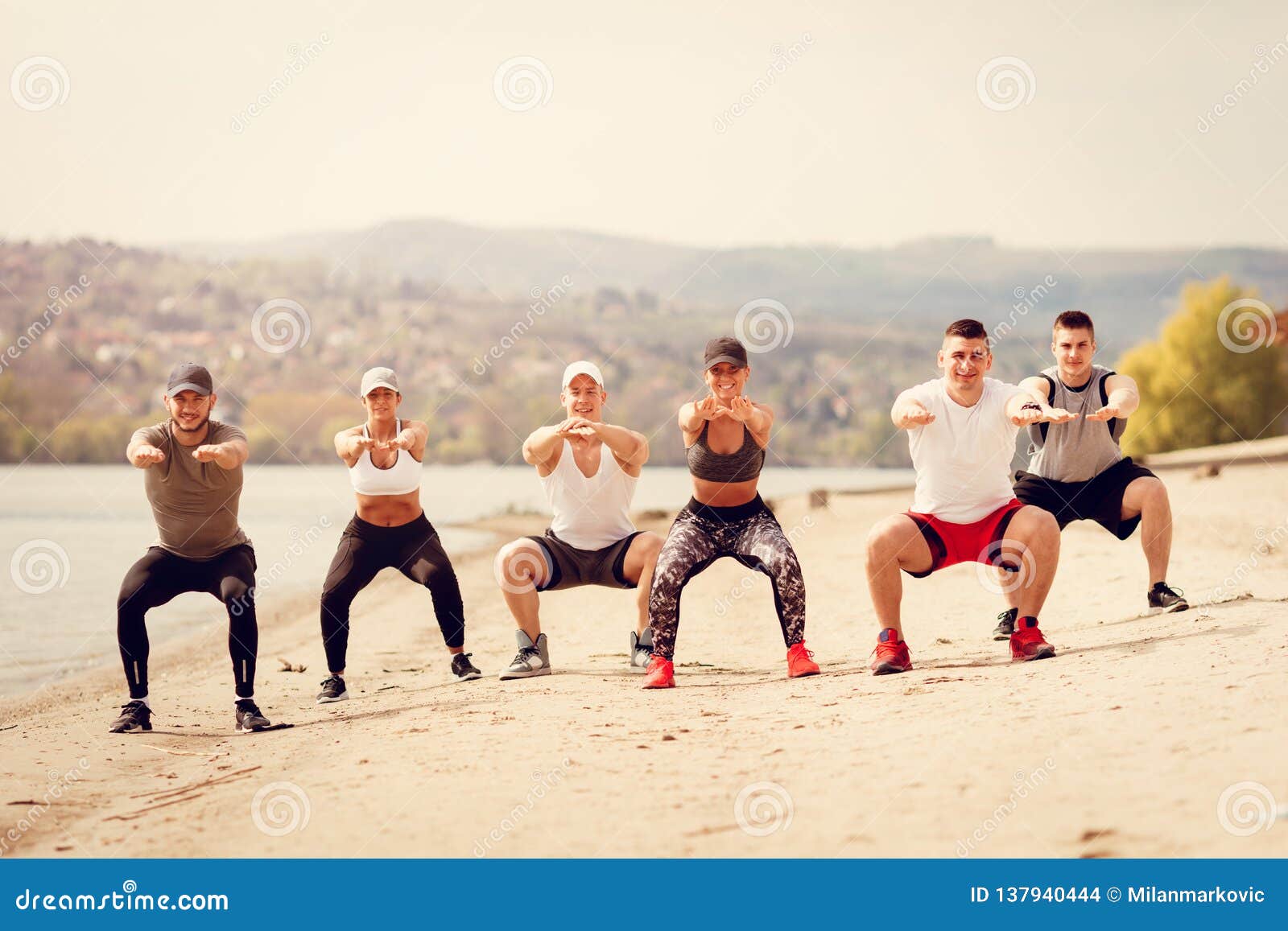 Group Friends Exercising on the Beach Stock Photo - Image of group ...