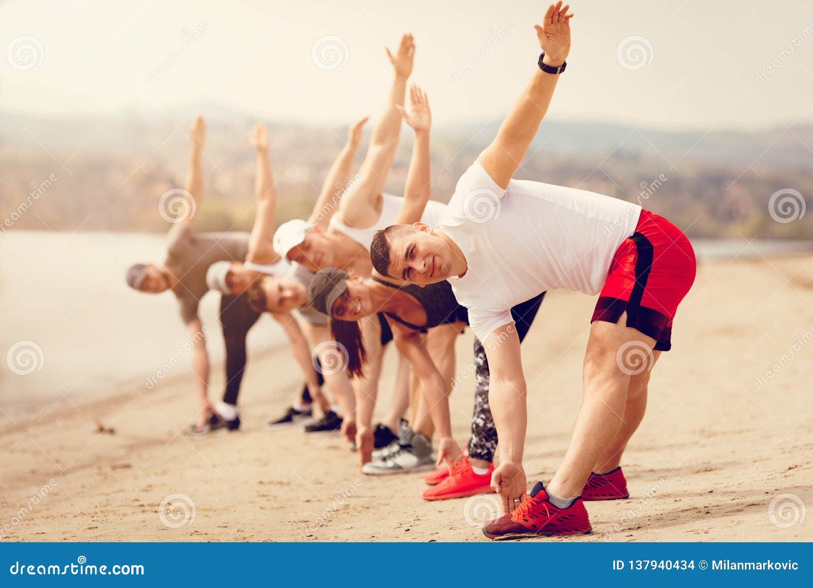 Group Friends Exercising on the Beach Stock Photo - Image of outdoor ...