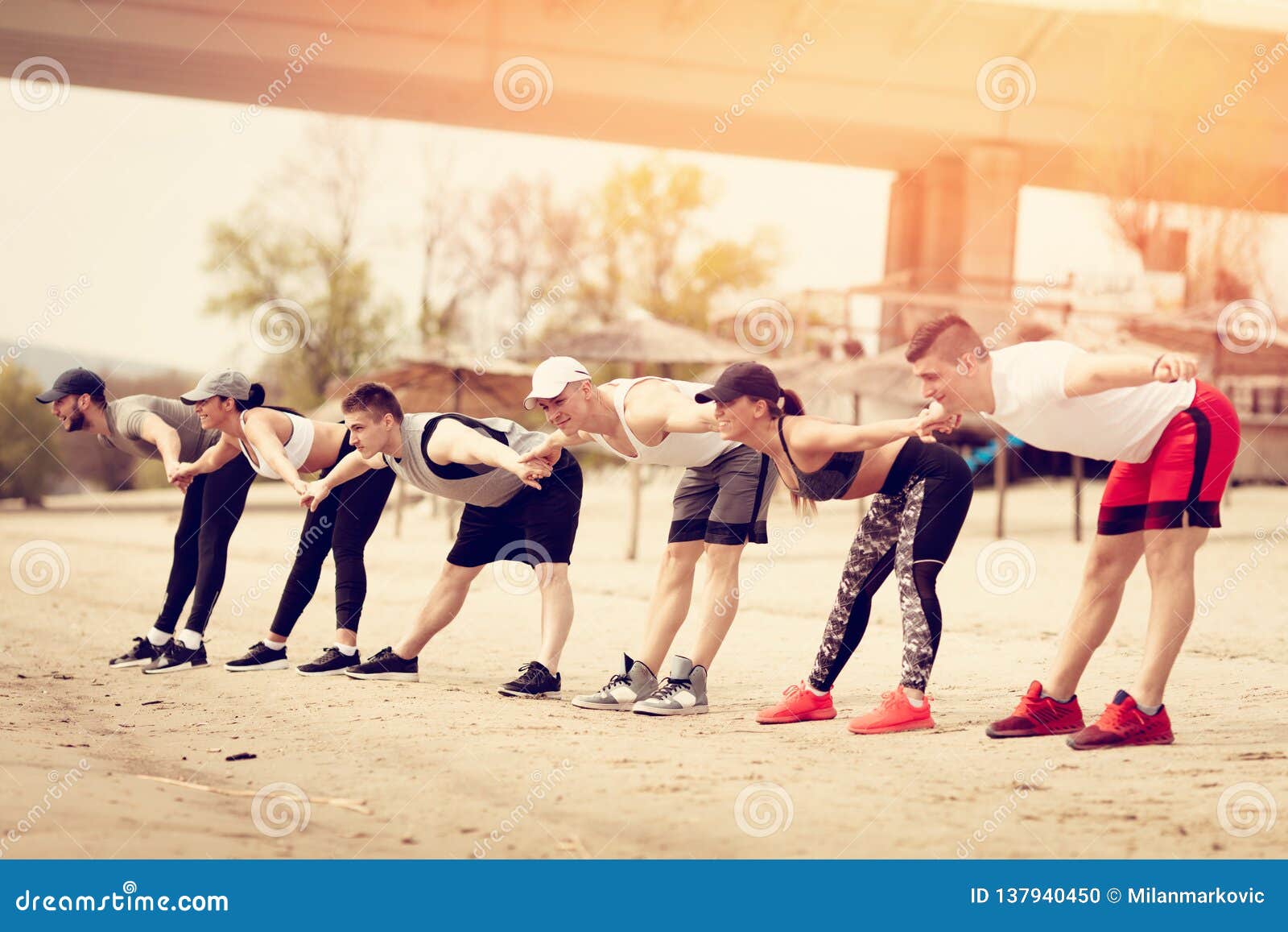 Group Friends Exercising on the Beach Stock Photo - Image of build ...