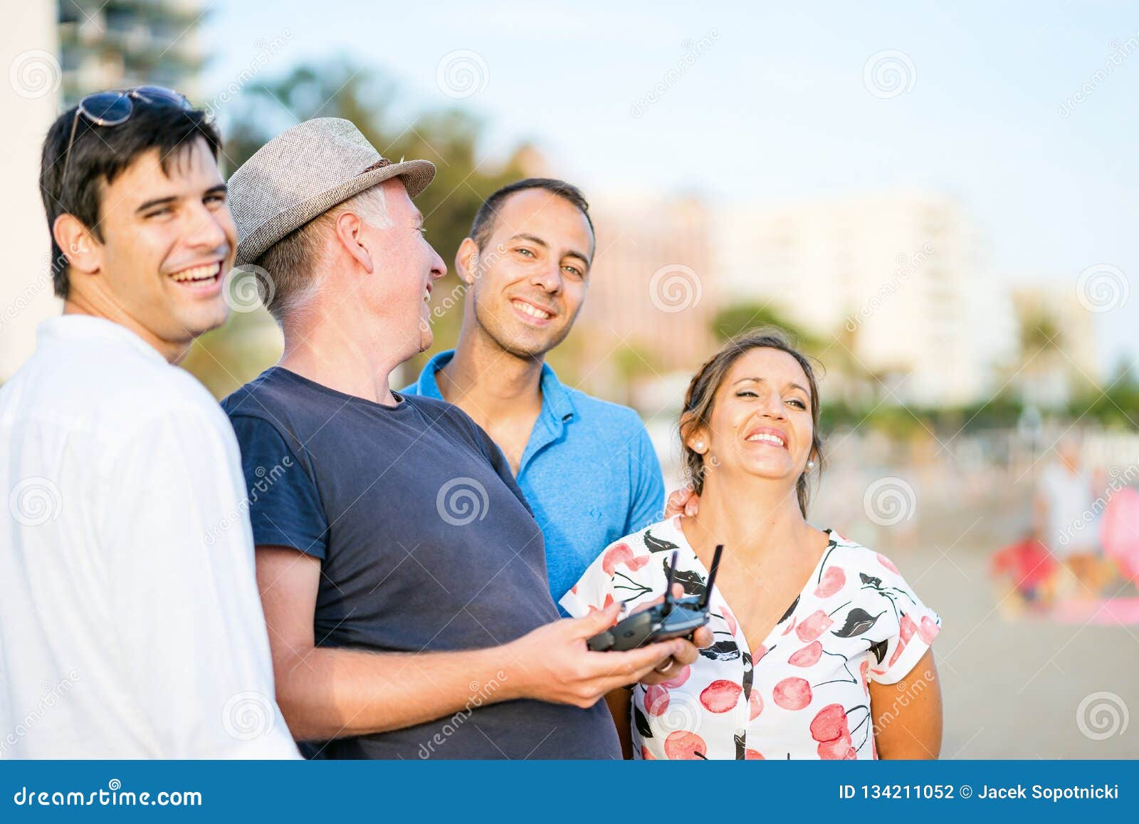 Group of Friends Flying a Drone Stock Photo - Image of friendship ...