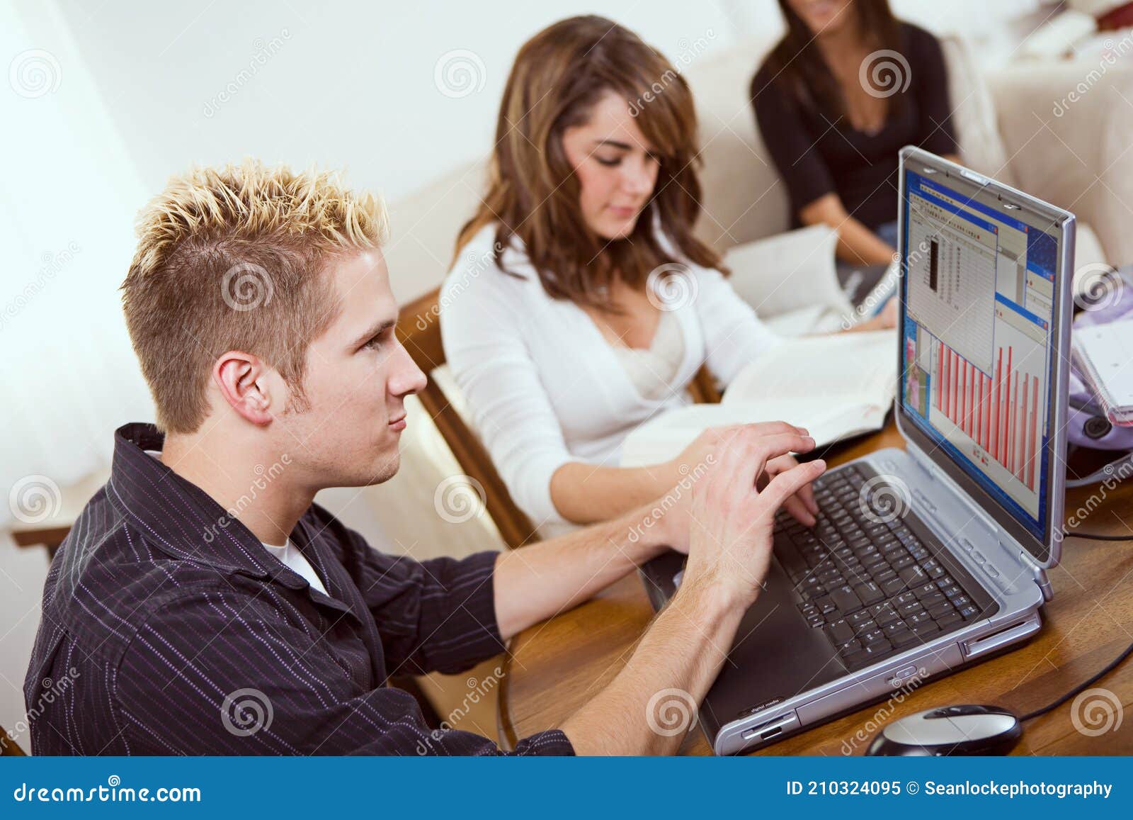 Students: Guy Doing Homework on Laptop Stock Image - Image of typing ...