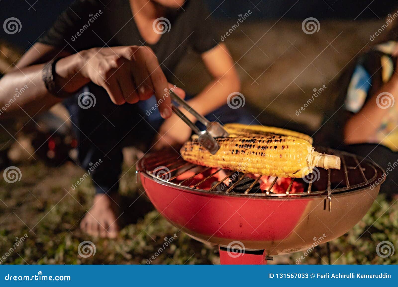 Group of Friends Having Fun Camping, Making Roasted Corn Stock Image ...
