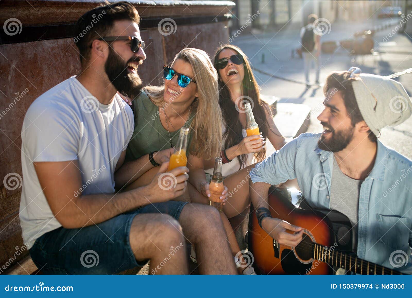 Group of Friends Having Fun and Hanging Out Outdoors Stock Photo ...