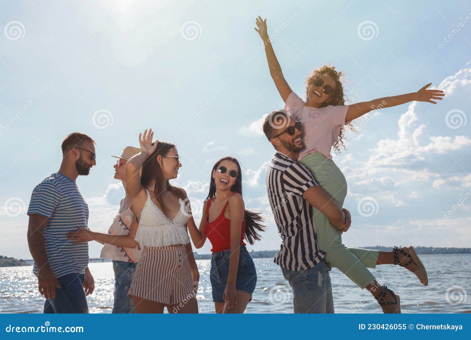 Group of Friends Having Fun Near River at Summer Party Stock Image ...