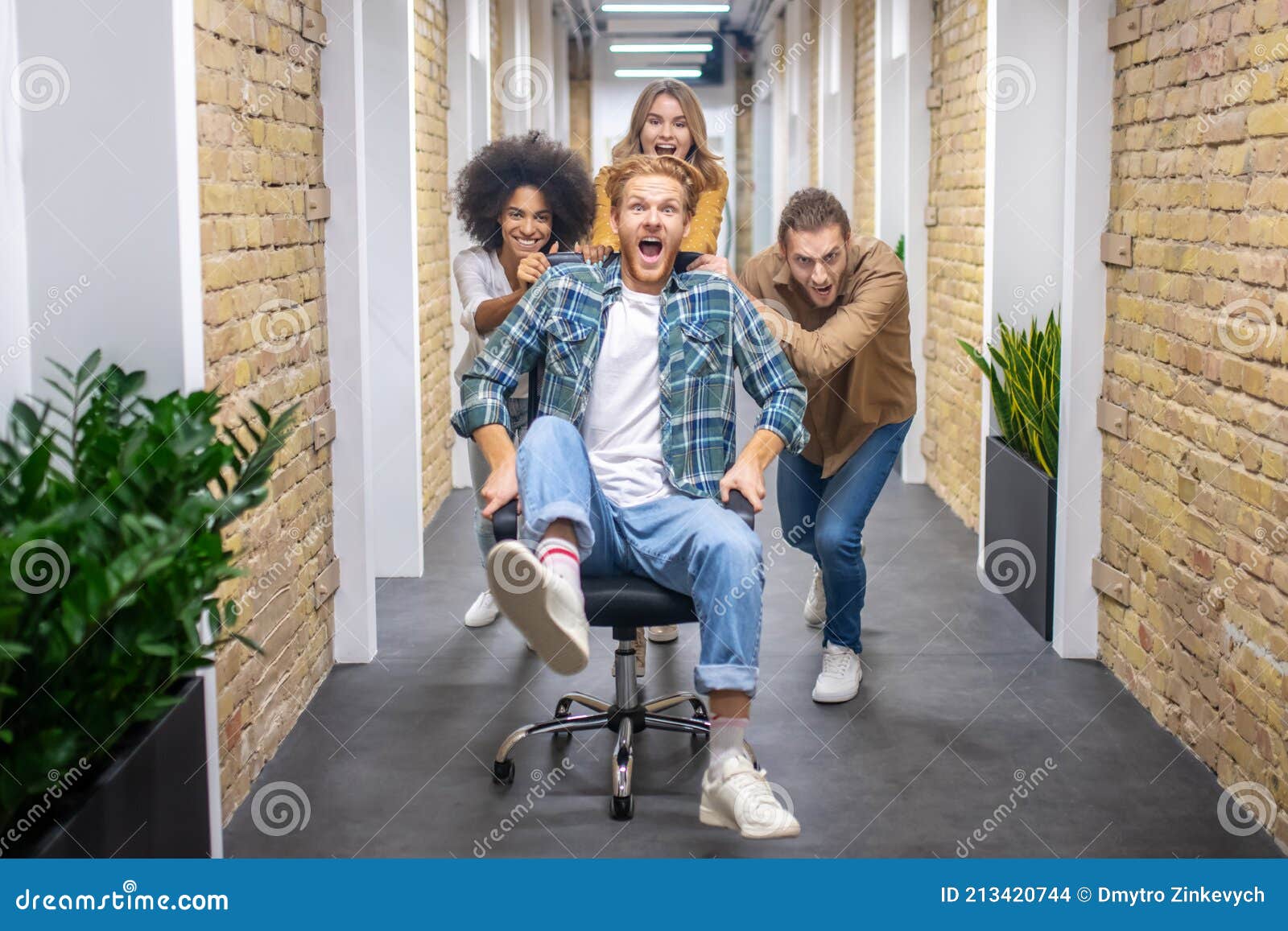Group of Friends Having Fun in the Office Corridor after a Nice Day ...