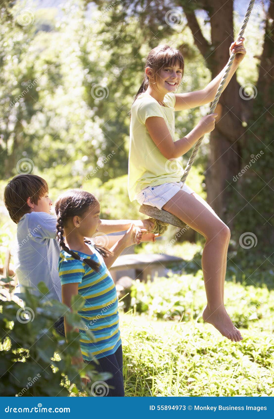 Group of Friends Having Fun on Rope Swing Stock Image - Image of ...