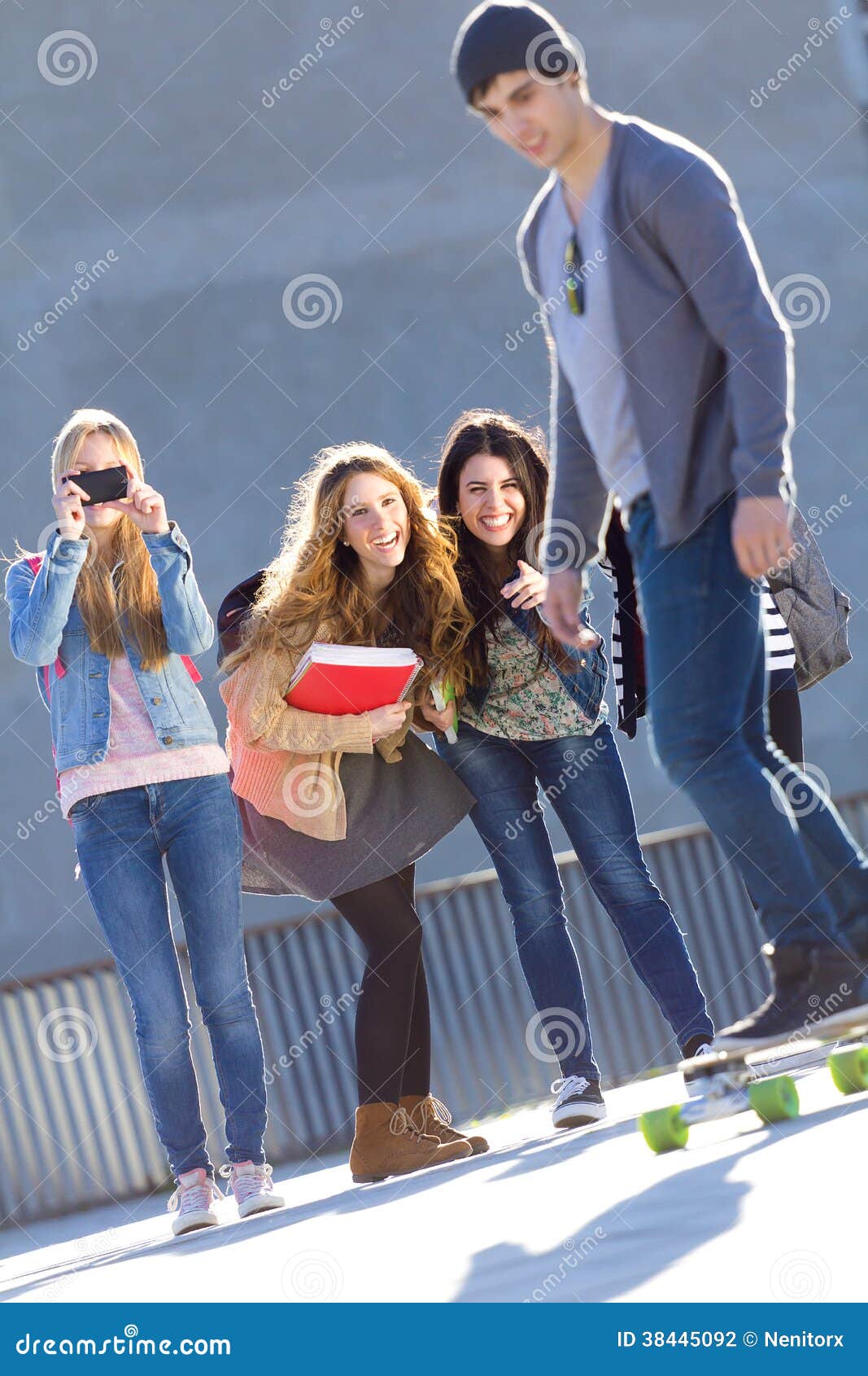 A Group of Friends Having Fun with Skate in the Street Stock Photo ...