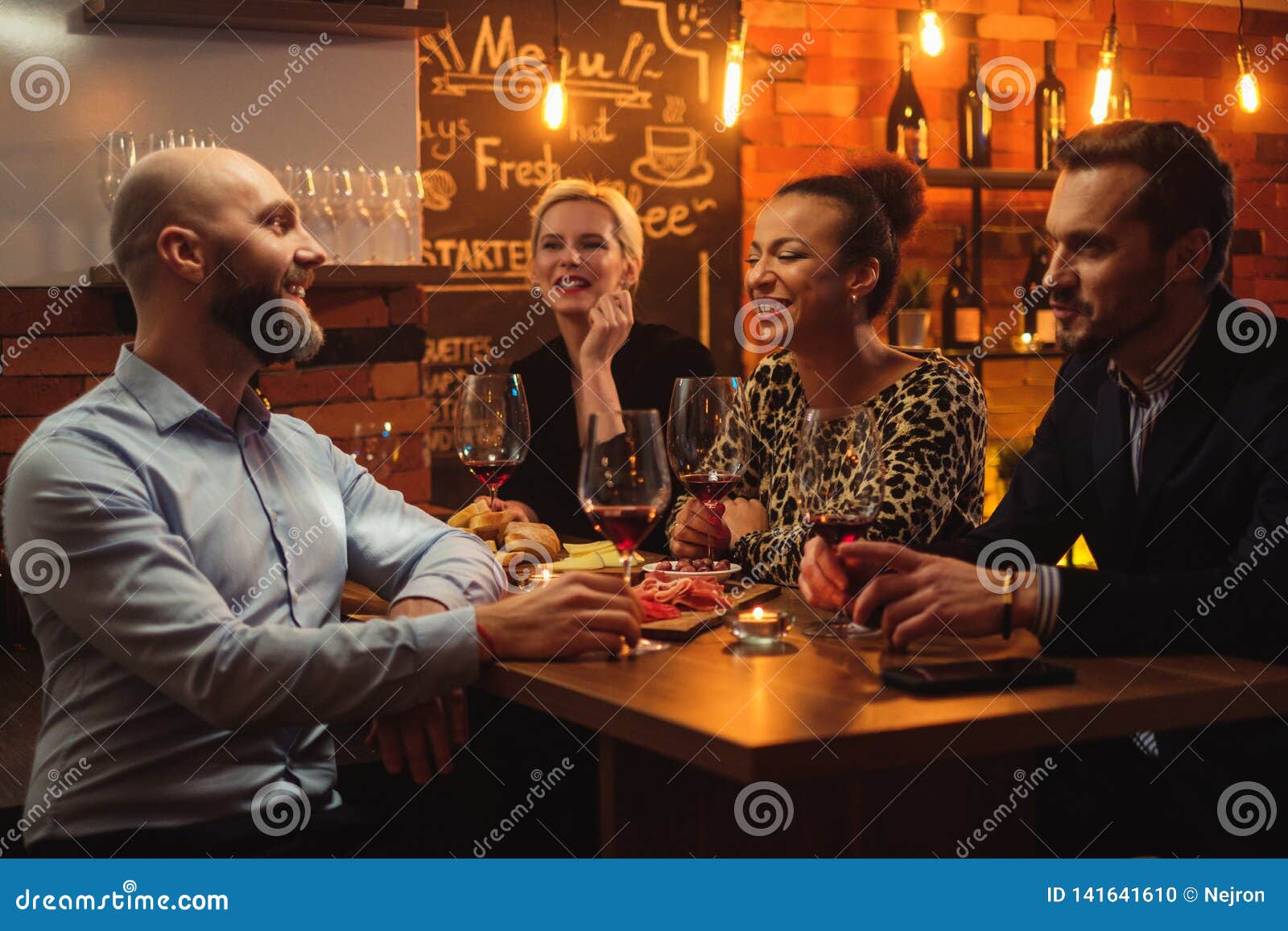 Group of Friends Having Fun Talk Behind Bar Counter in a Cafe Stock ...