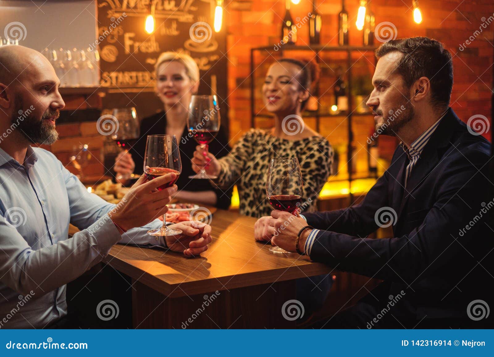 Group of Friends Having Fun Talk Behind Bar Counter in a Cafe Stock ...