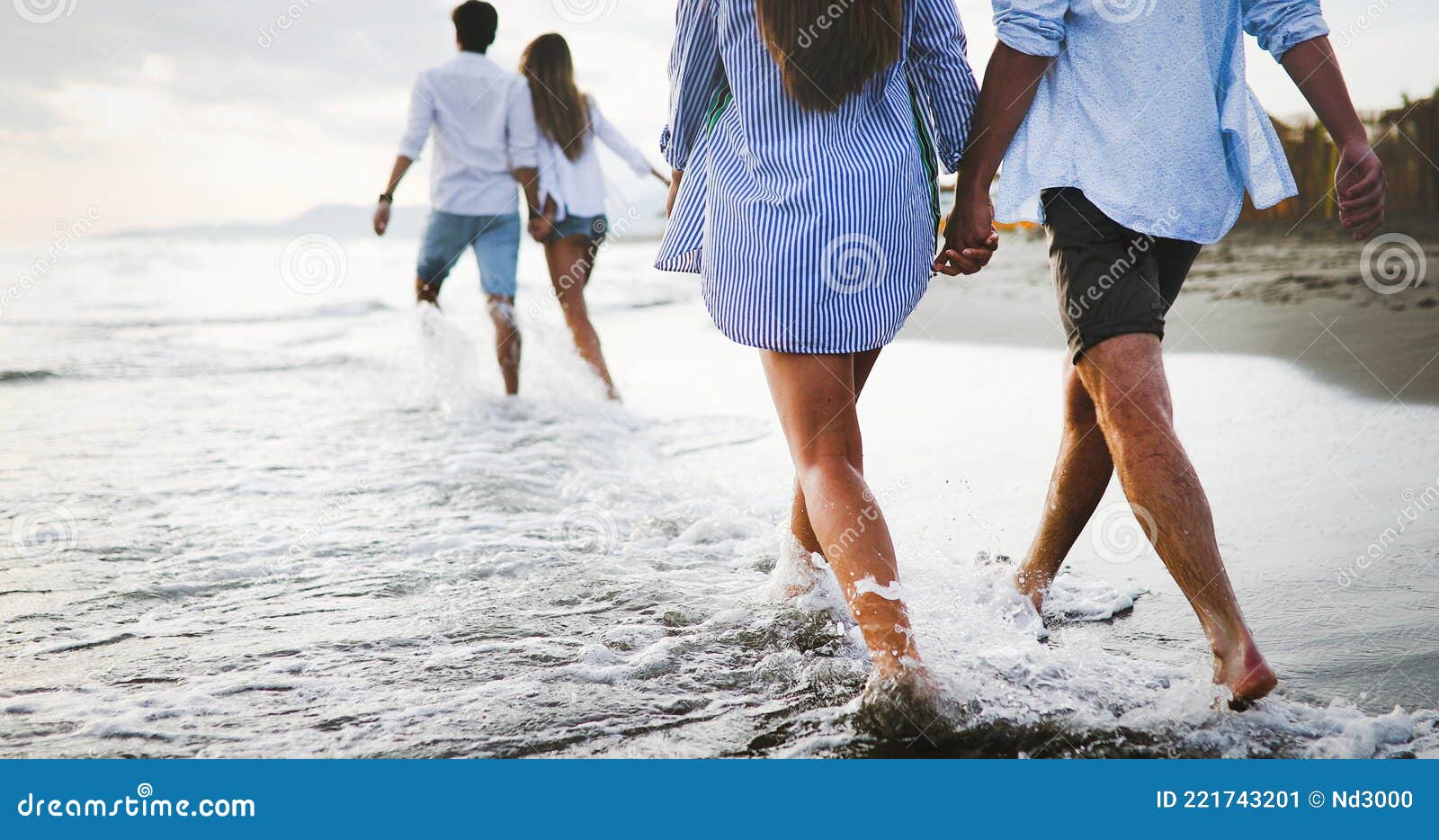 Group of Friends Having Fun and Walking on the Beach at Sunset Stock ...