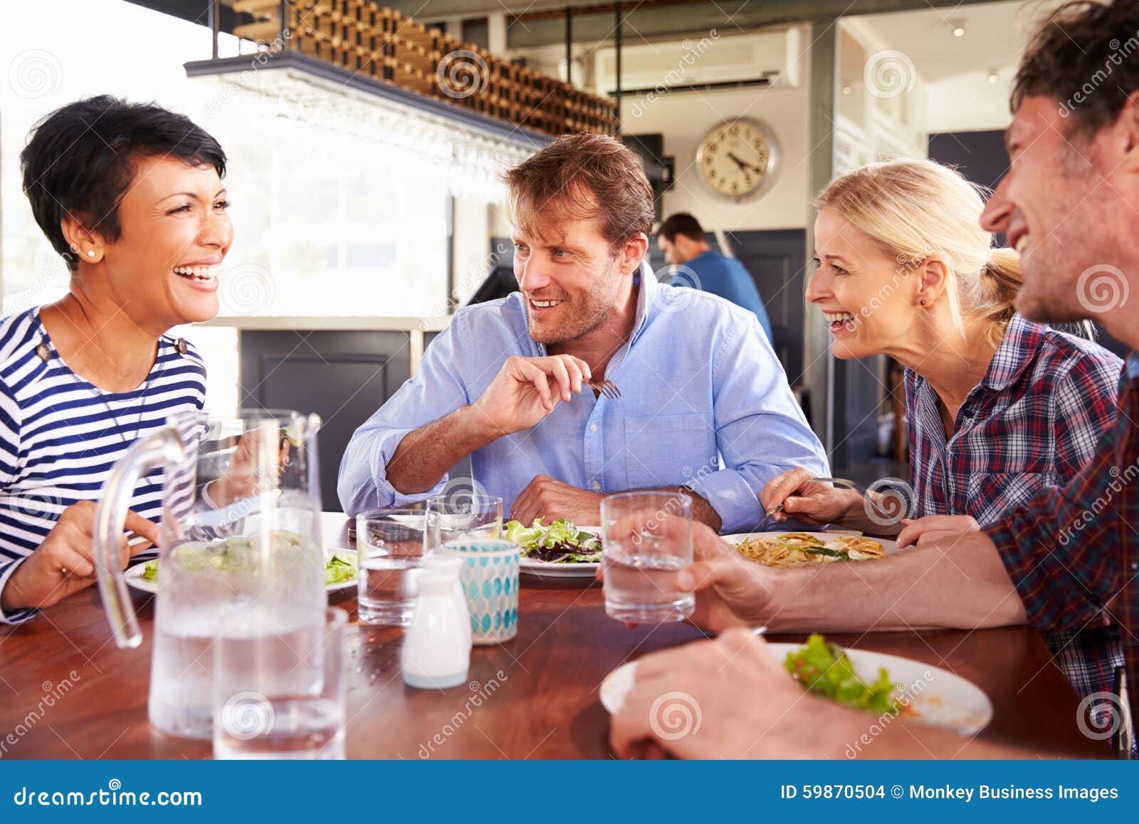 A Group of Friends Having Lunch in a Restaurant Stock Photo - Image of ...