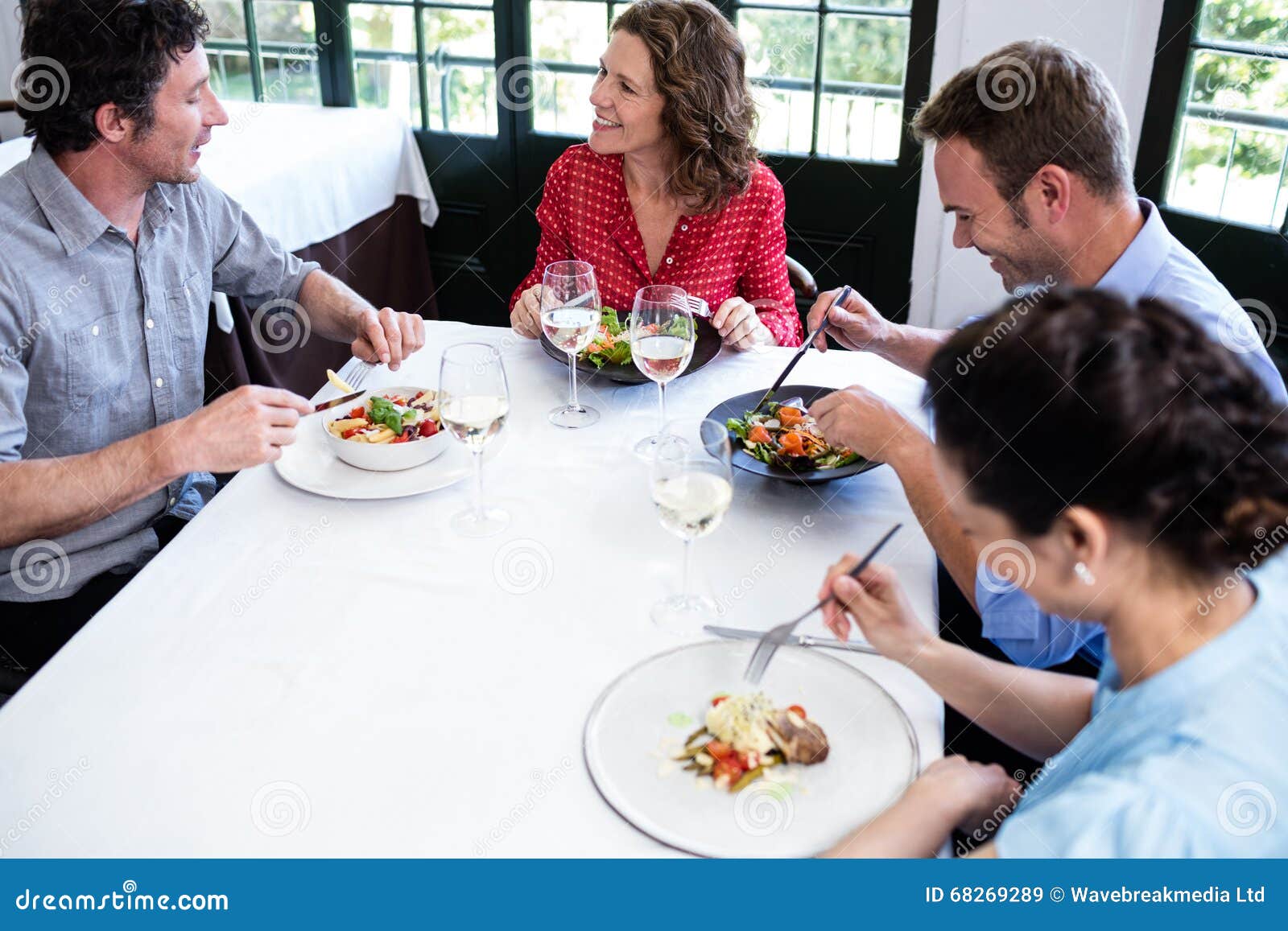 Group of Friends Having Lunch Stock Image - Image of meal, holding ...