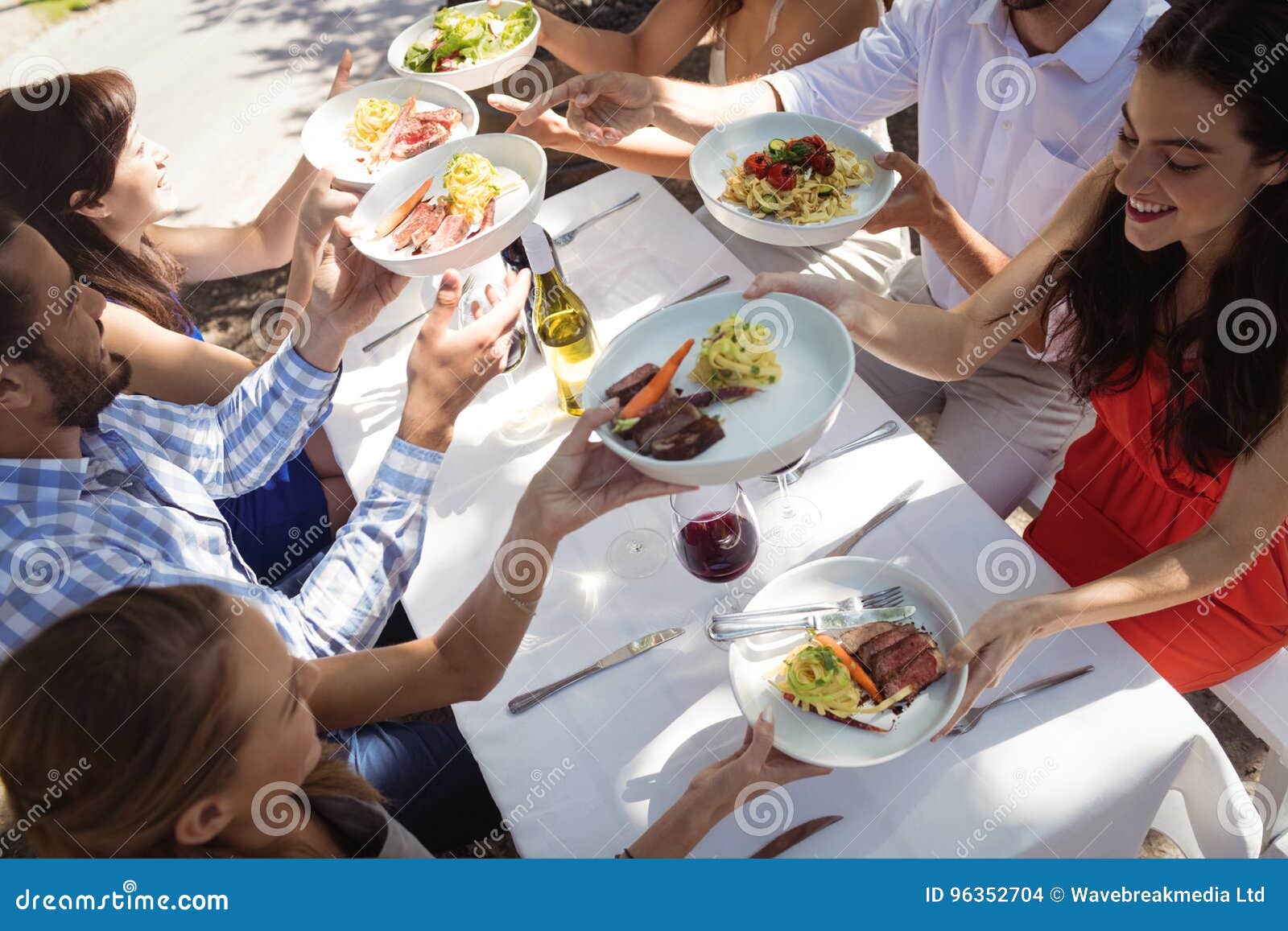 Group of Friends Having Lunch Stock Photo - Image of passing, casual ...