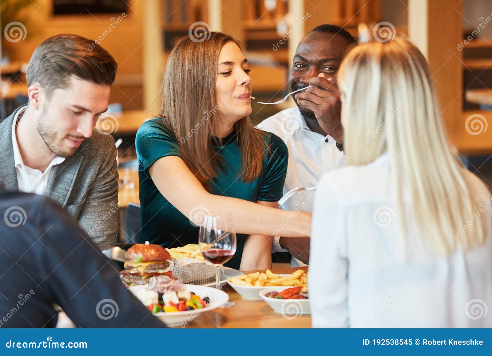 Group of Friends Having Lunch Together Stock Image - Image of local ...