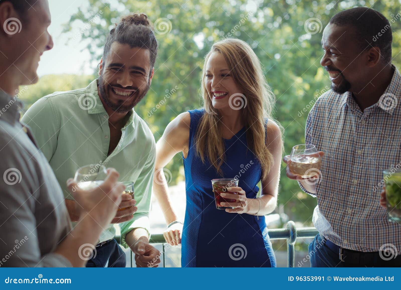 Group of Friends Interacting with Each Other while Having Cocktail ...