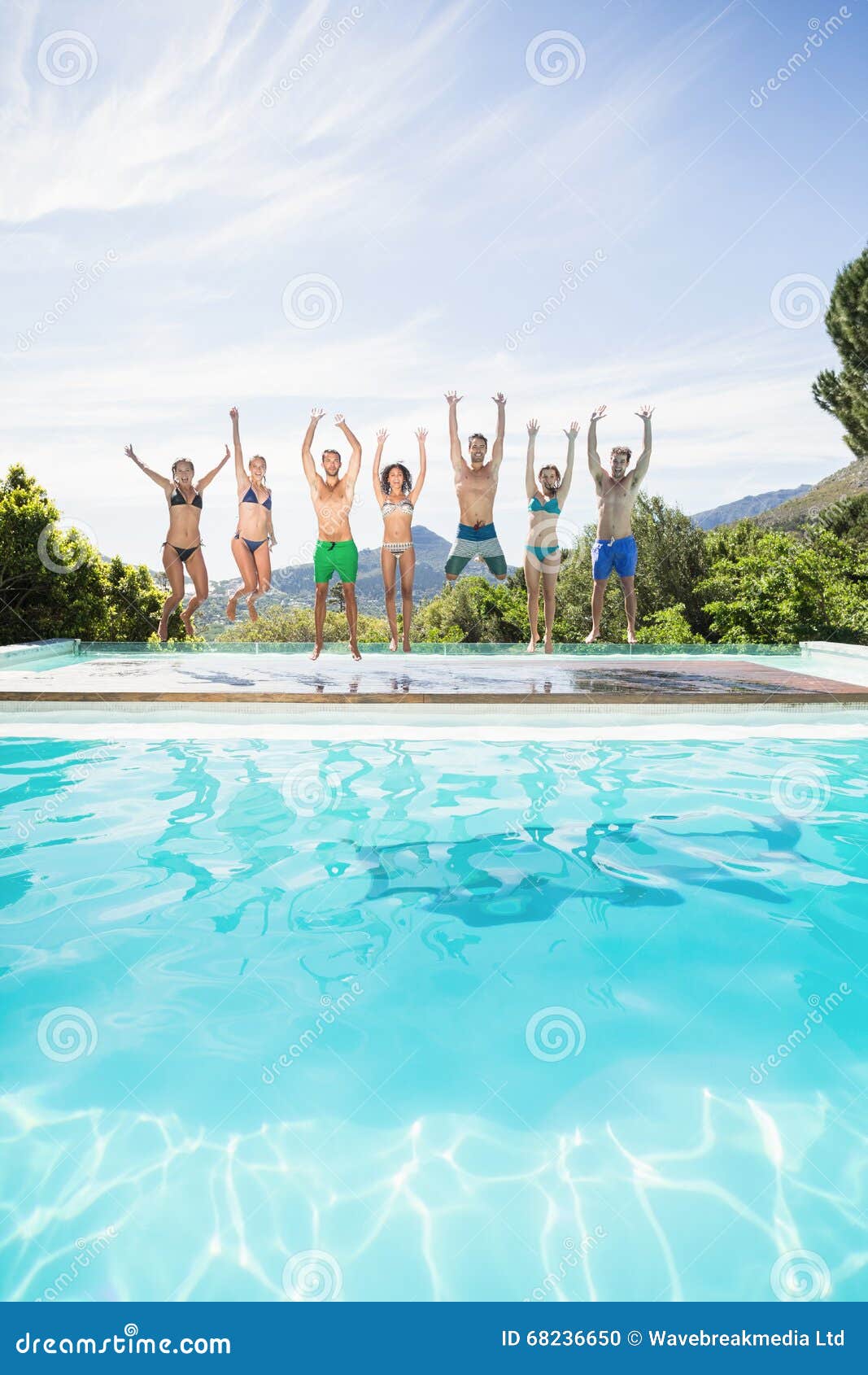 Group of Friends Jumping at Poolside Stock Photo - Image of length ...