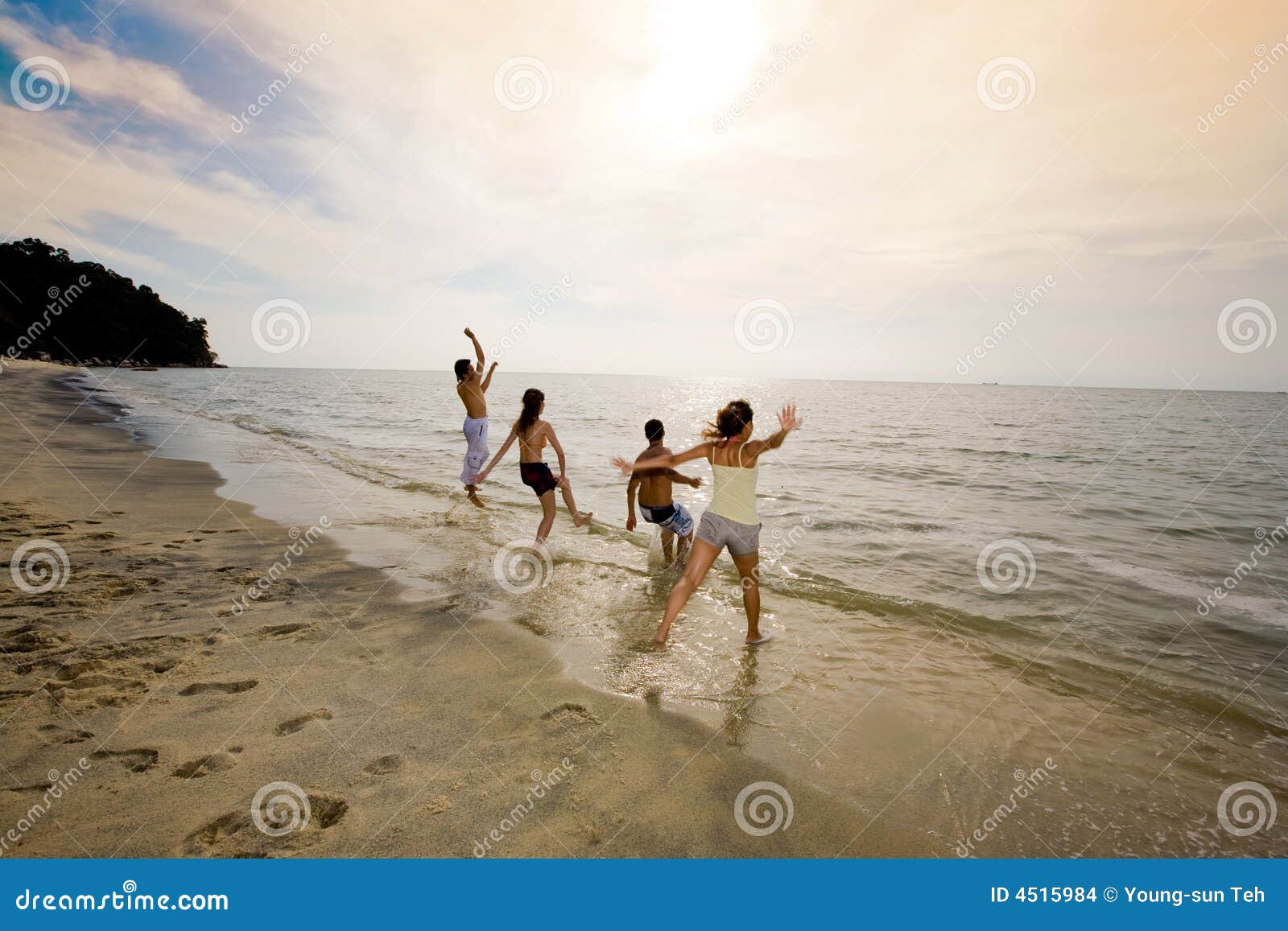 Group of Friends Jumping at the Sunset Beach Stock Photo - Image of ...