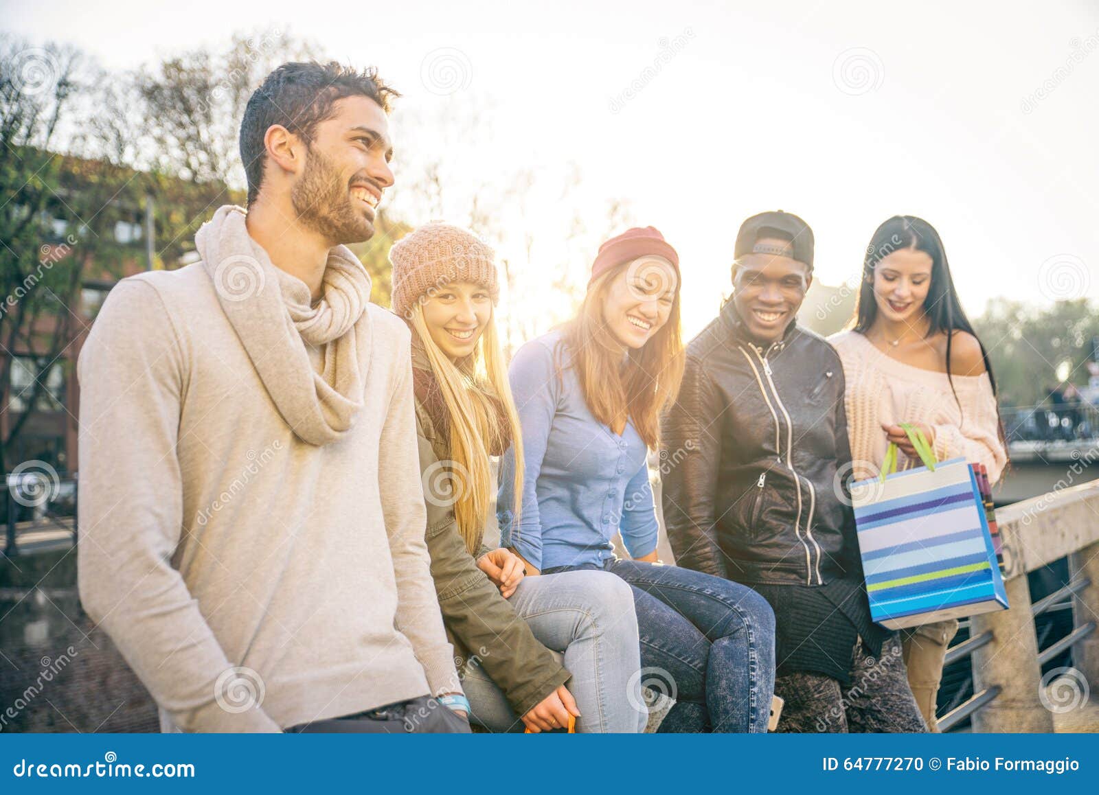 Group of friends laughing stock photo. Image of campus - 64777270