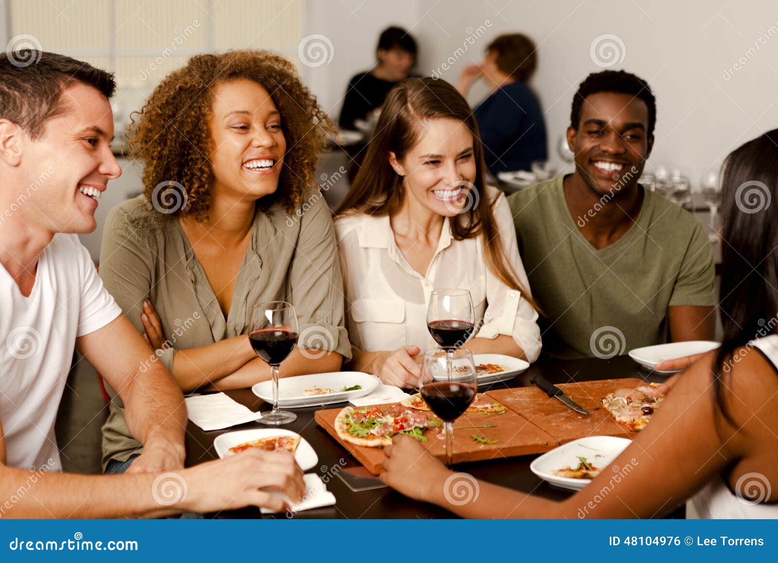Group of Friends Laughing in a Restaurant Stock Photo - Image of ...