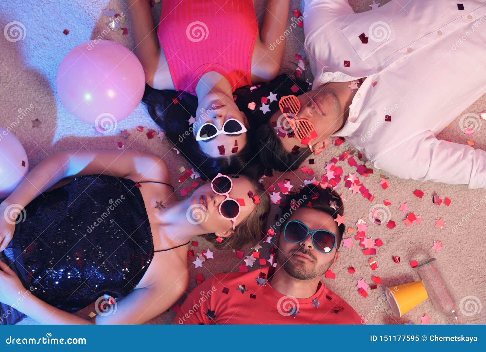 Group of Friends Lying on Messy Floor after Party Stock Image - Image ...