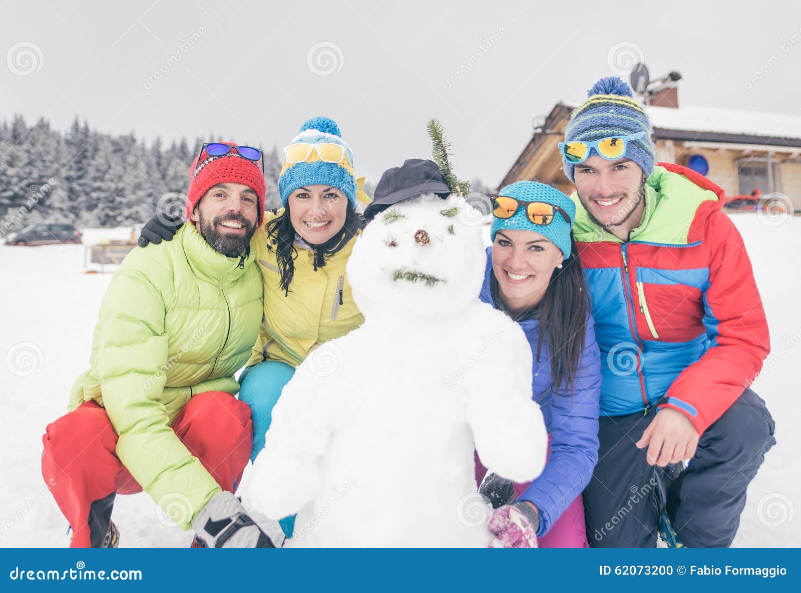 Group of Friends Made a Snowman Stock Photo - Image of outdoors, frozen ...