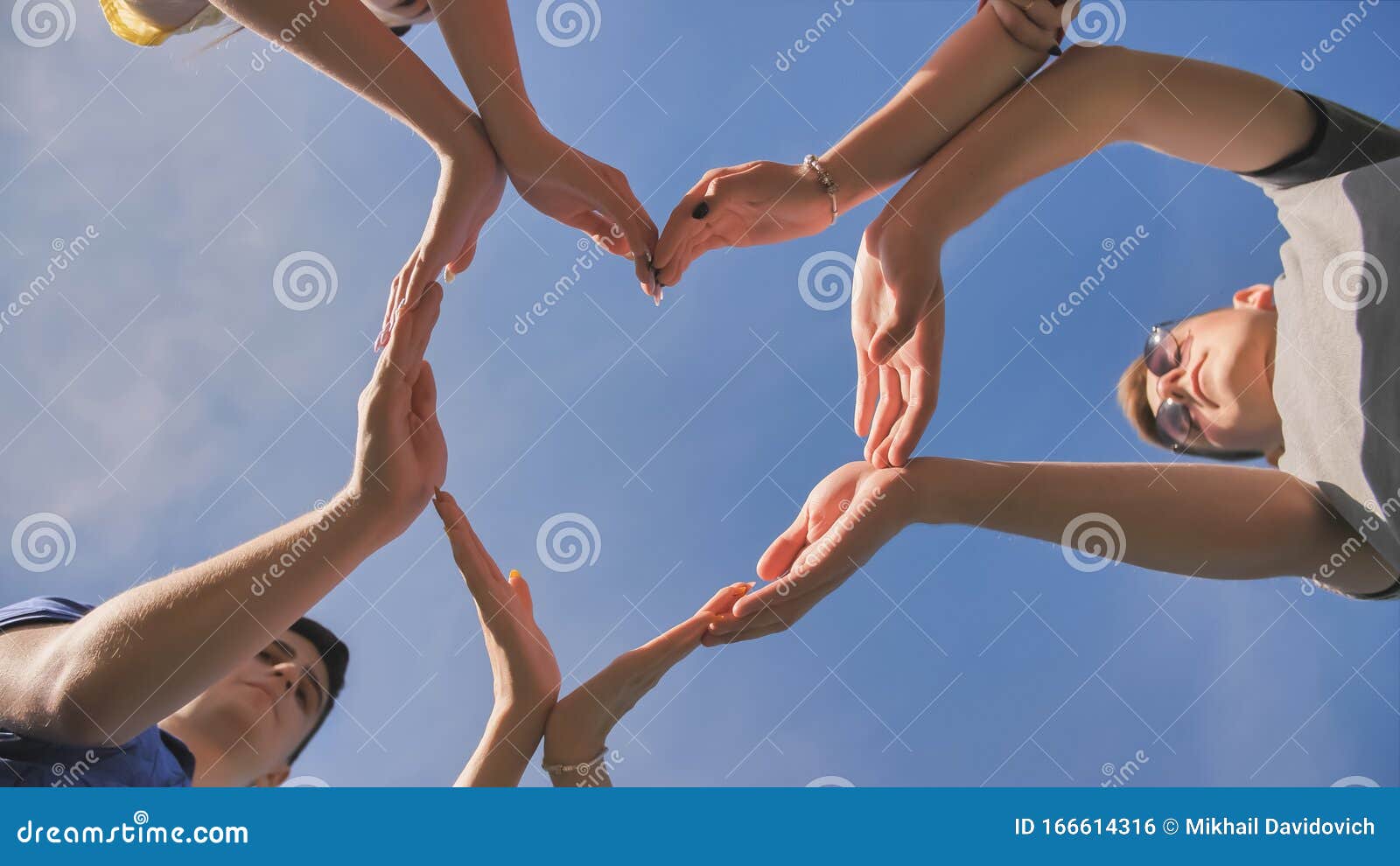 A Group of Friends Makes a Heart Shape Out of Their Hands. Stock Photo ...